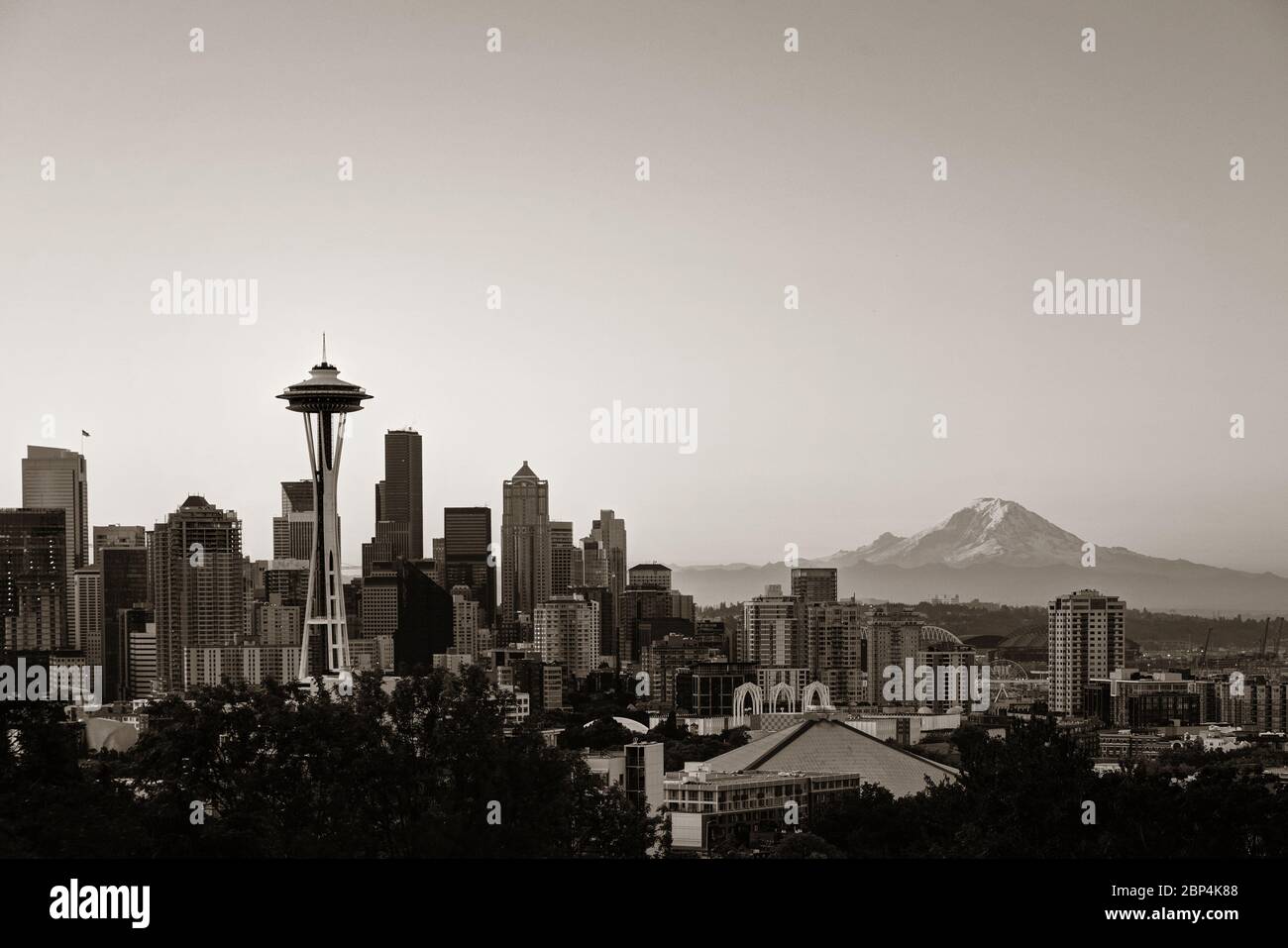 Seattle city skyline with Mt Rainier at sunset with urban office ...