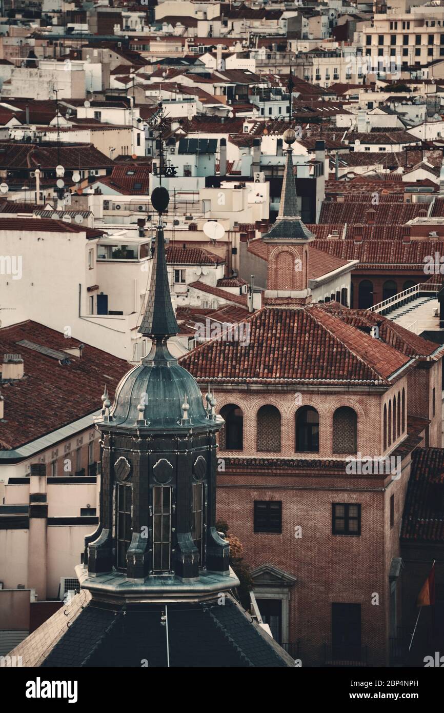 Madrid skyline rooftop view with buildings and church bell tower in ...