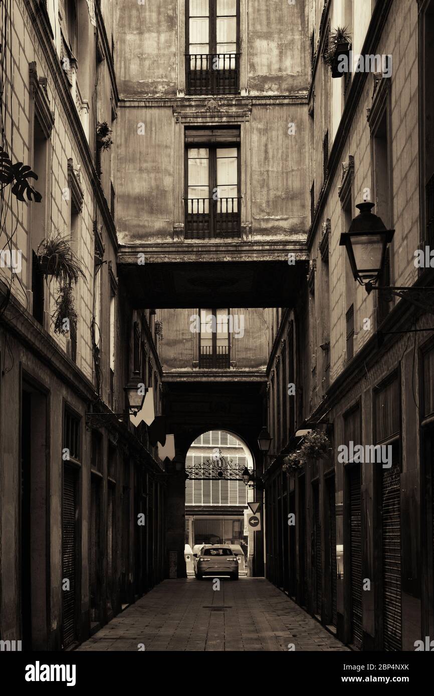 Street view of small alley with historic buildings in Madrid, Spain ...