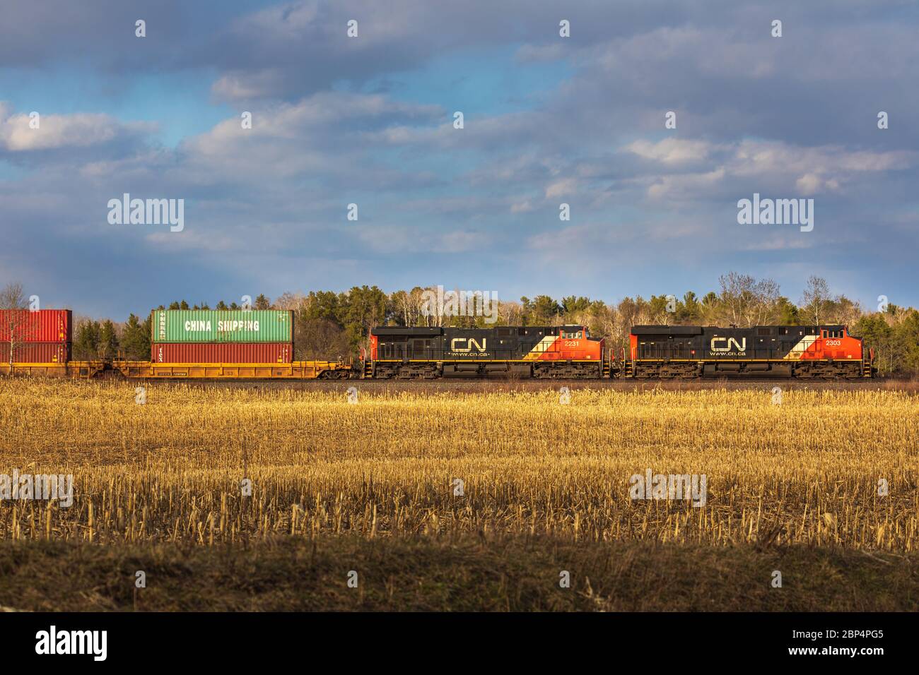 CN freight train passing through a farming community in Exeland ...