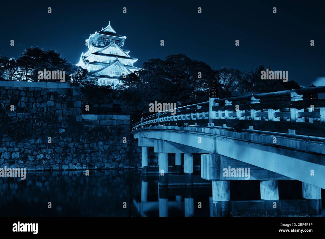 Osaka Castle at night as the famous historical landmark of the city ...