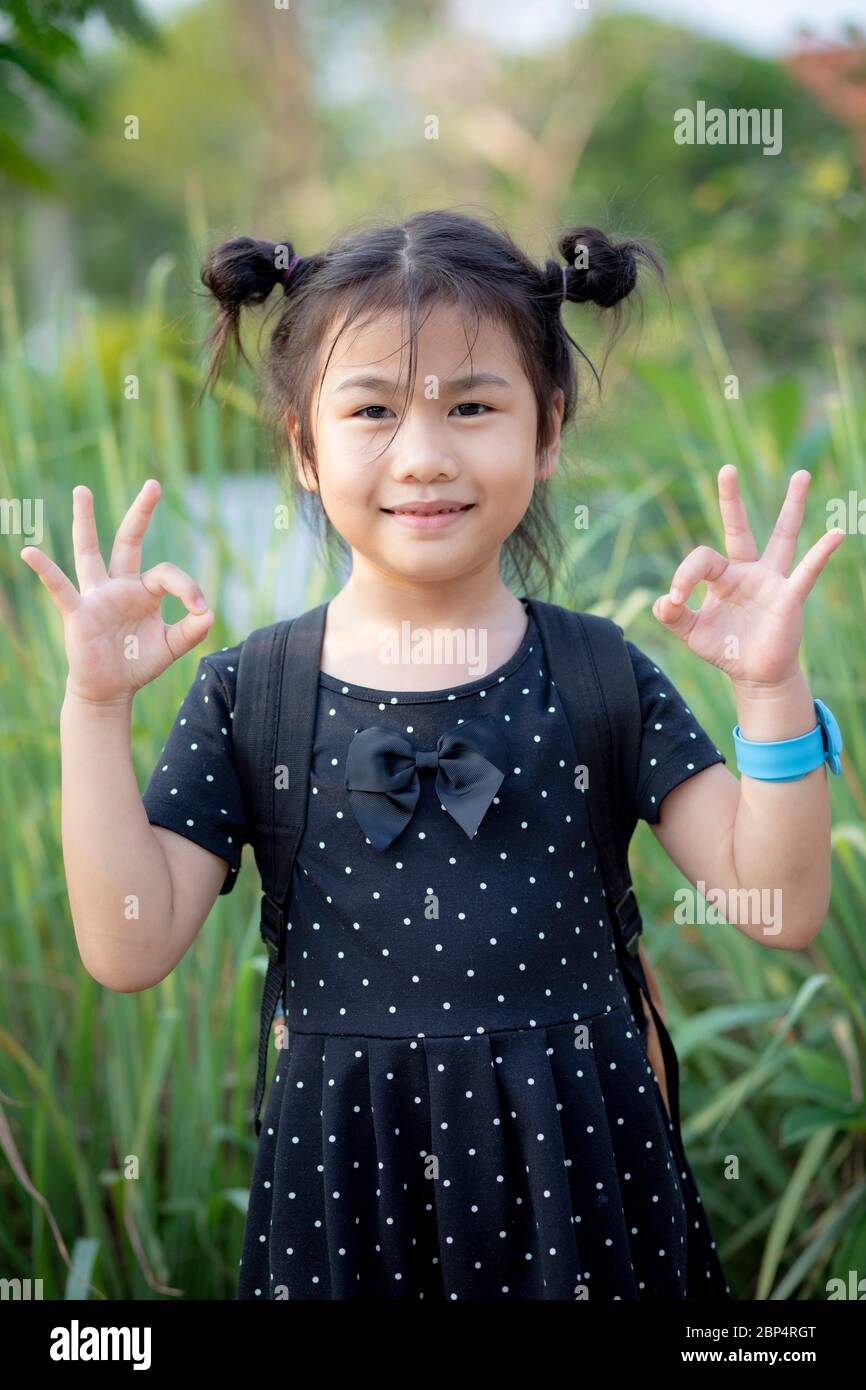 asian children with smiling face and hand sign for okay Stock Photo - Alamy