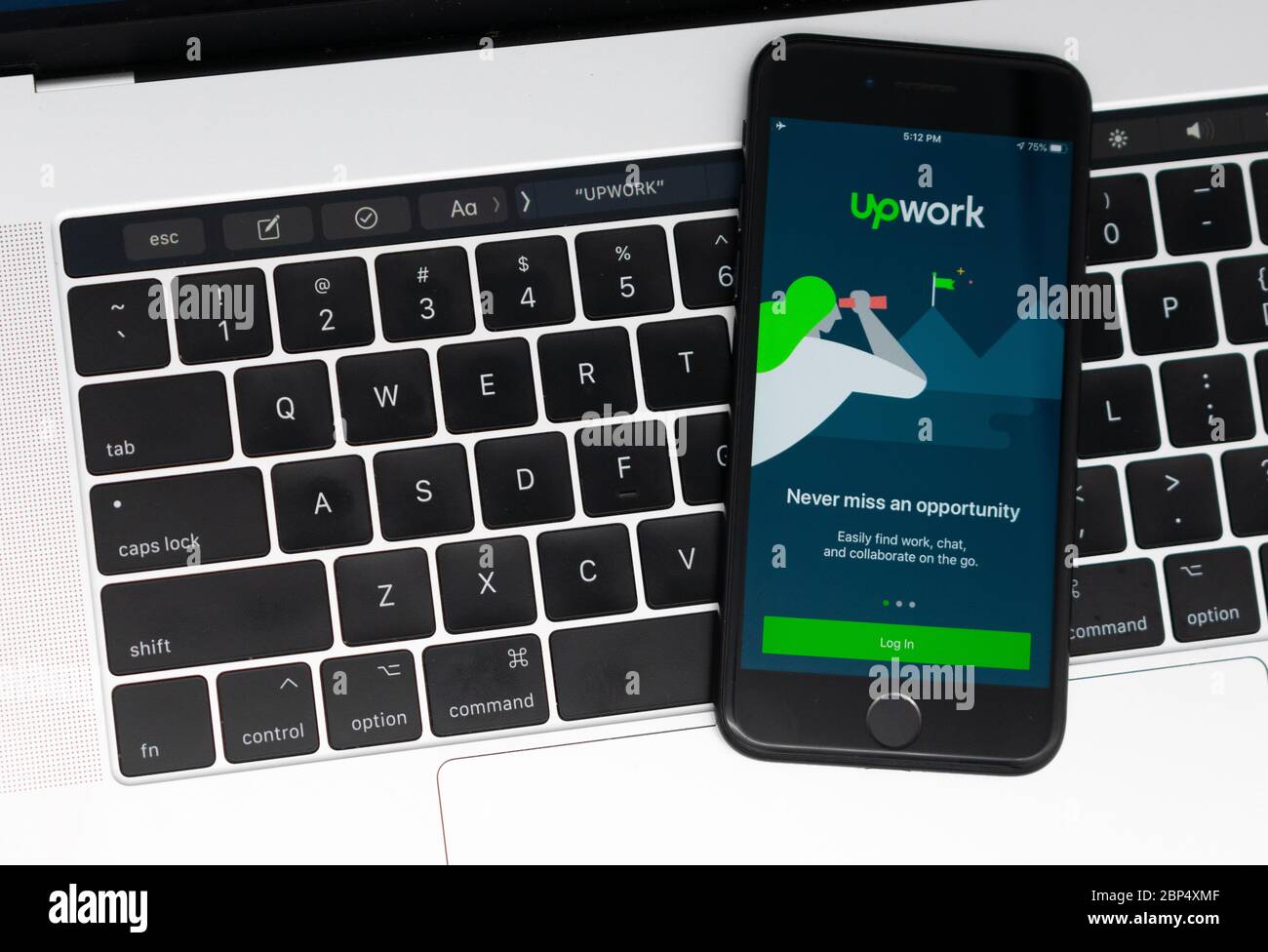Upwork for Freelancers mobile app login page on a smartphone. Upwork is ...
