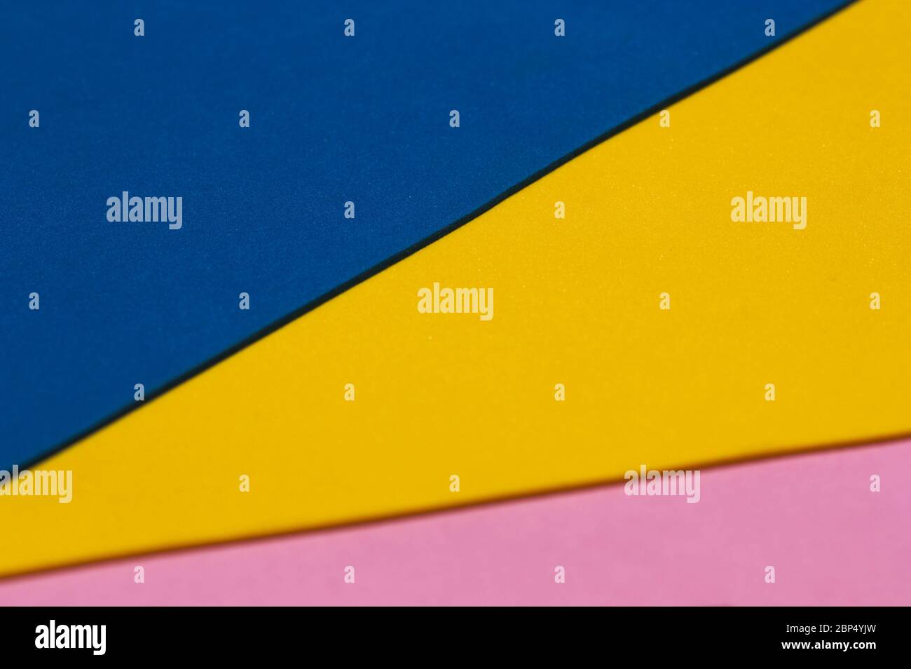 Three surfaces of three different colors that form an angle between ...