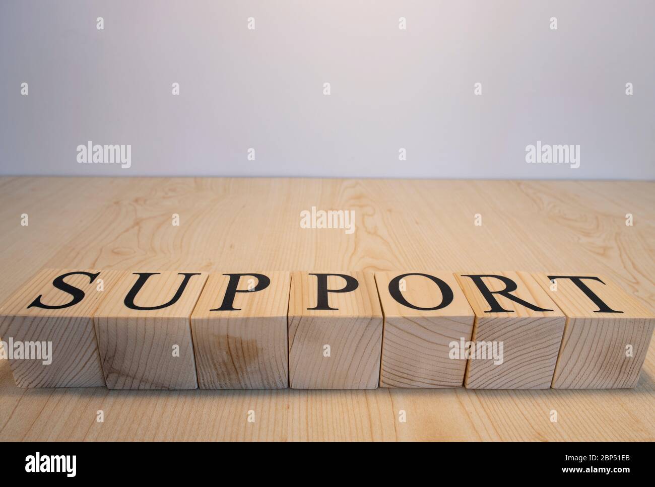 Support text from wooden cubes. Photos were taken on the wooden desk ...