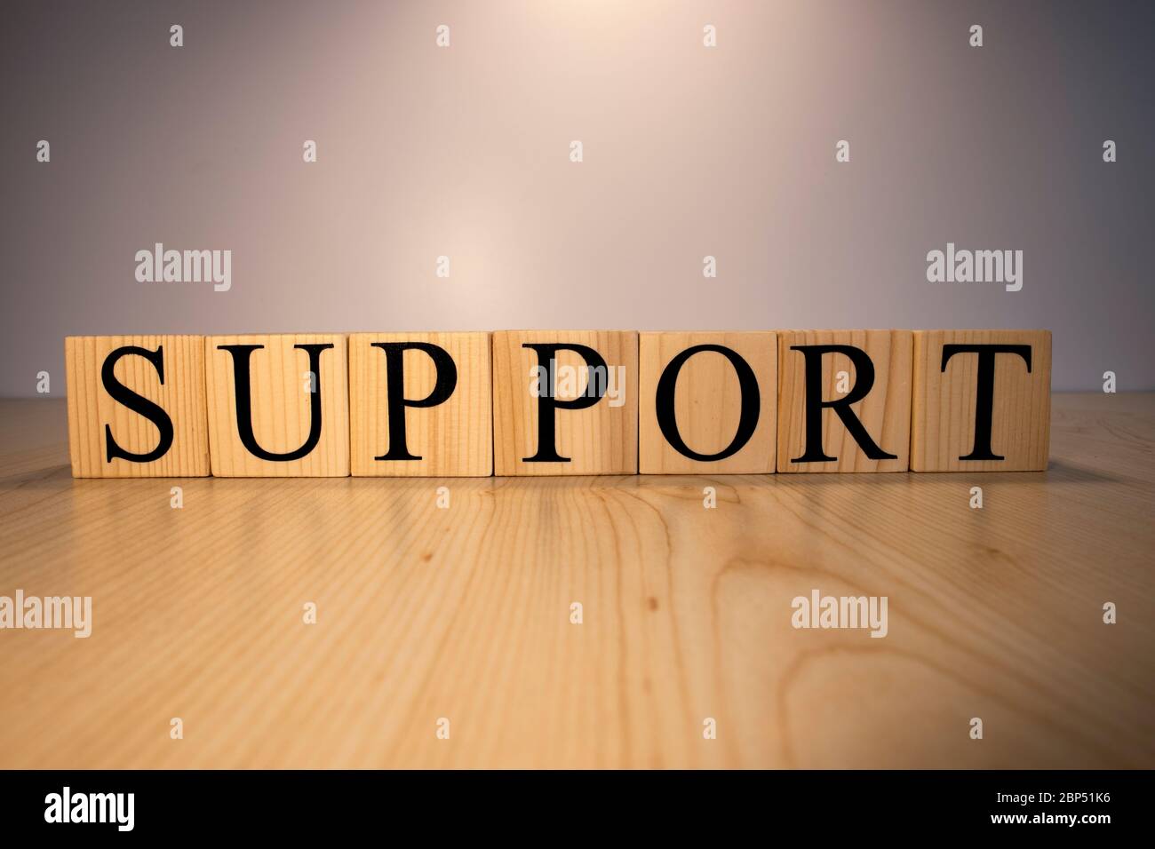 Support text from wooden cubes. Photos were taken on the wooden desk ...