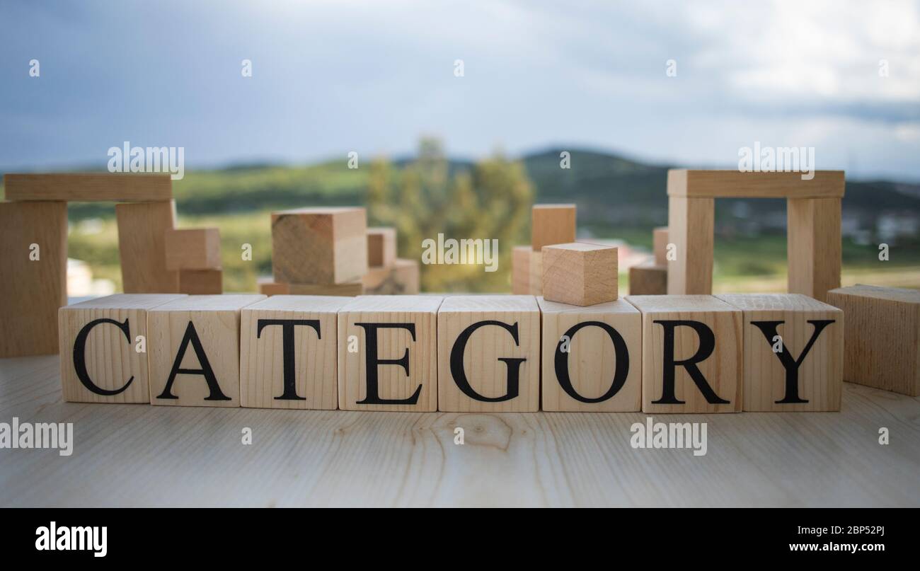 Category blocks wooden blocks font. A photo was taken on the table ...