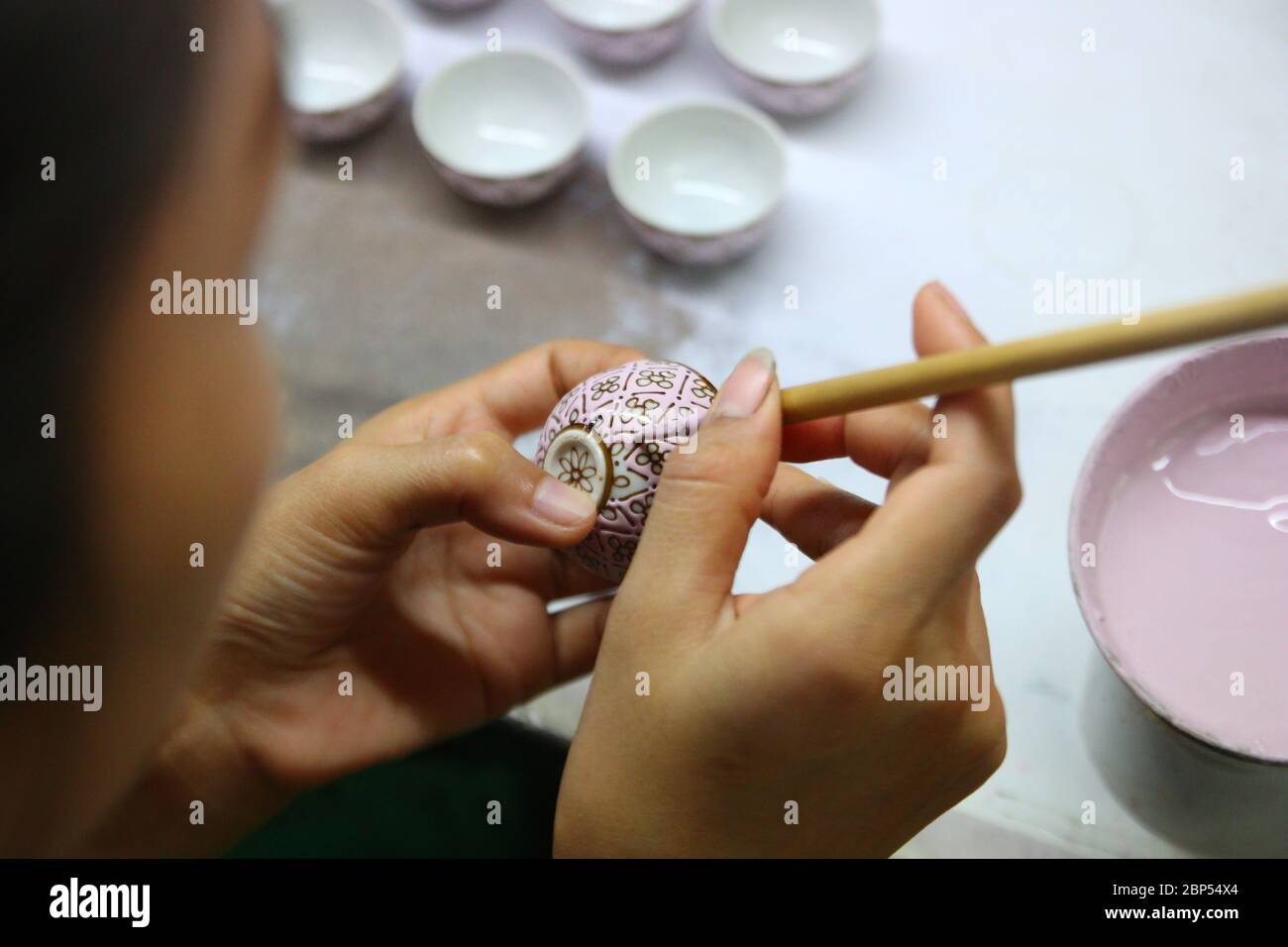 artist painting benjarong ceramic ware , A traditional Thai five ...