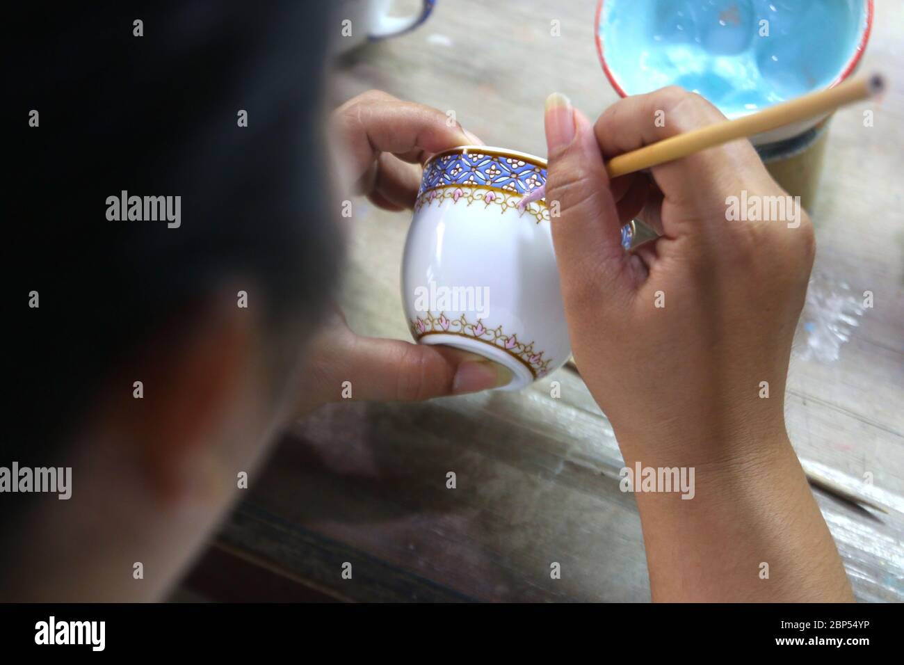 artist painting benjarong ceramic ware , A traditional Thai five ...