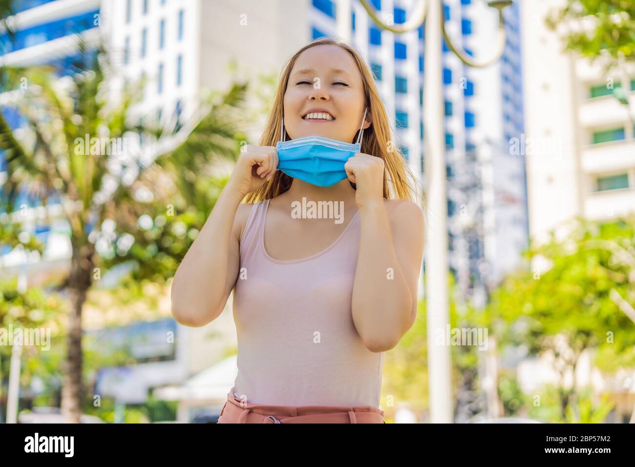 Taking off mask hi-res stock photography and images - Alamy
