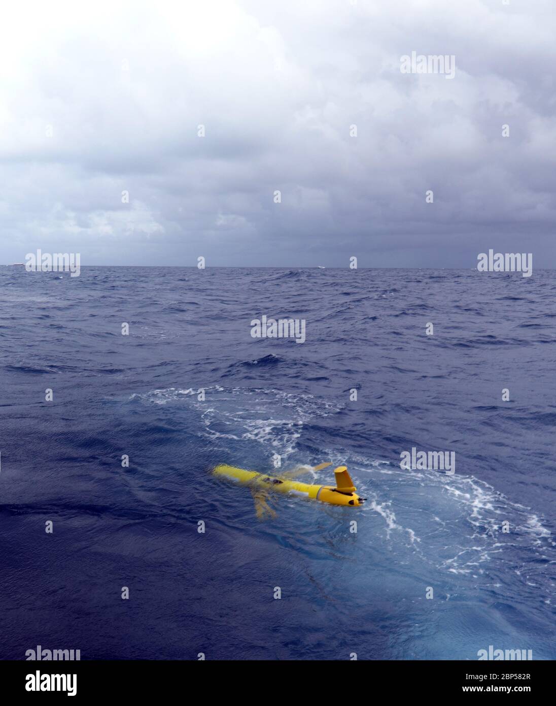 Slocum ocean glider on surface of stormy sea, Great Barrier Reef ...