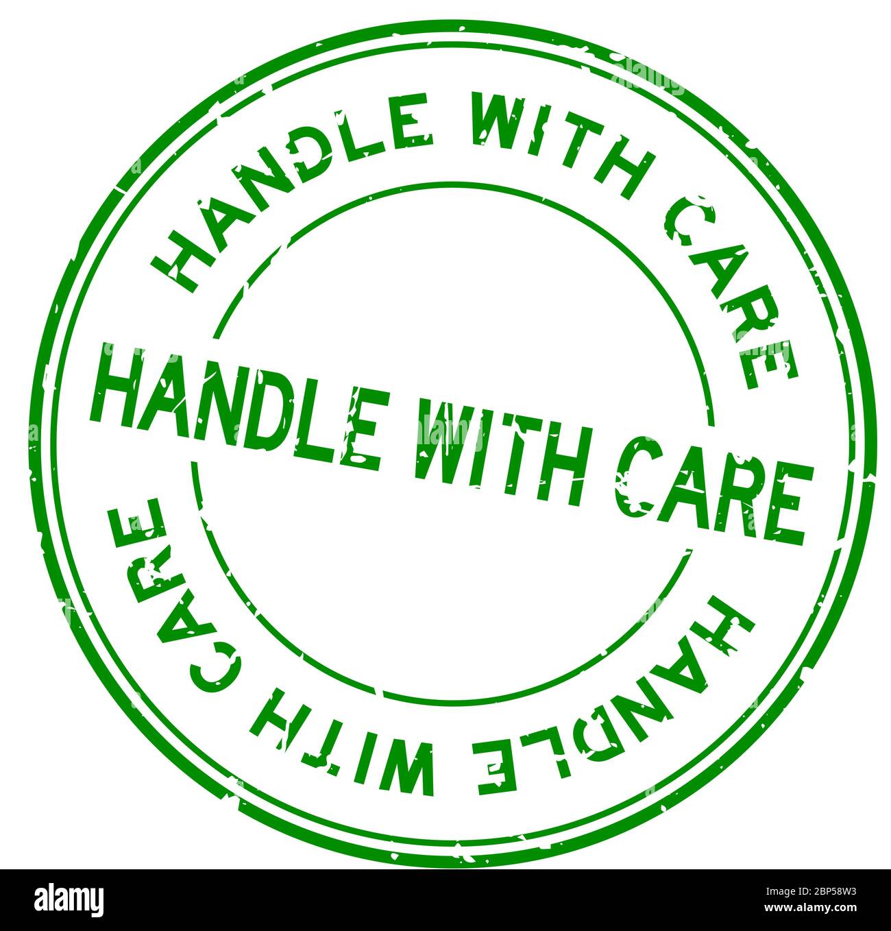 Grunge green handle with care word round rubber seal stamp on white ...