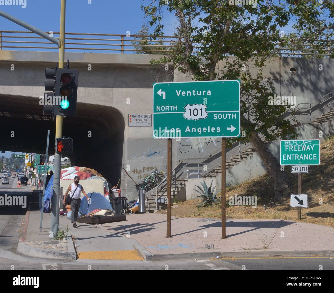 A homeless encampment is pictured under a U.S. Route 101 underpass in ...
