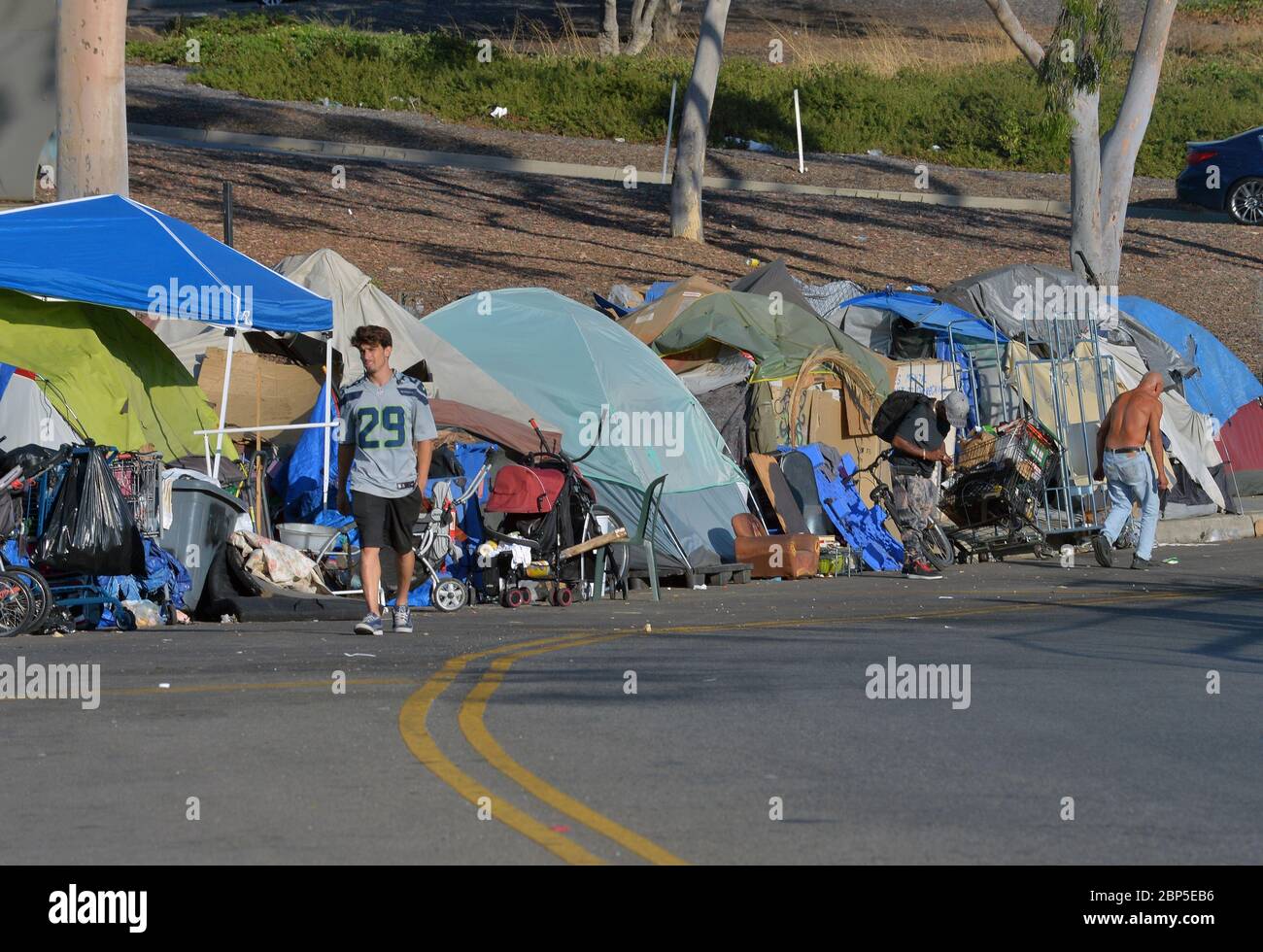 A homeless encampment is pictured adjacent to Interstate 110 in ...