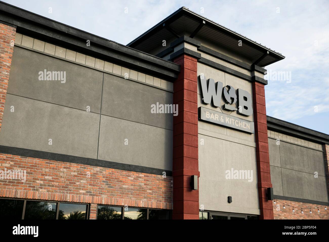 A logo sign outside of a World of Beer (WOB) restaurant location in ...