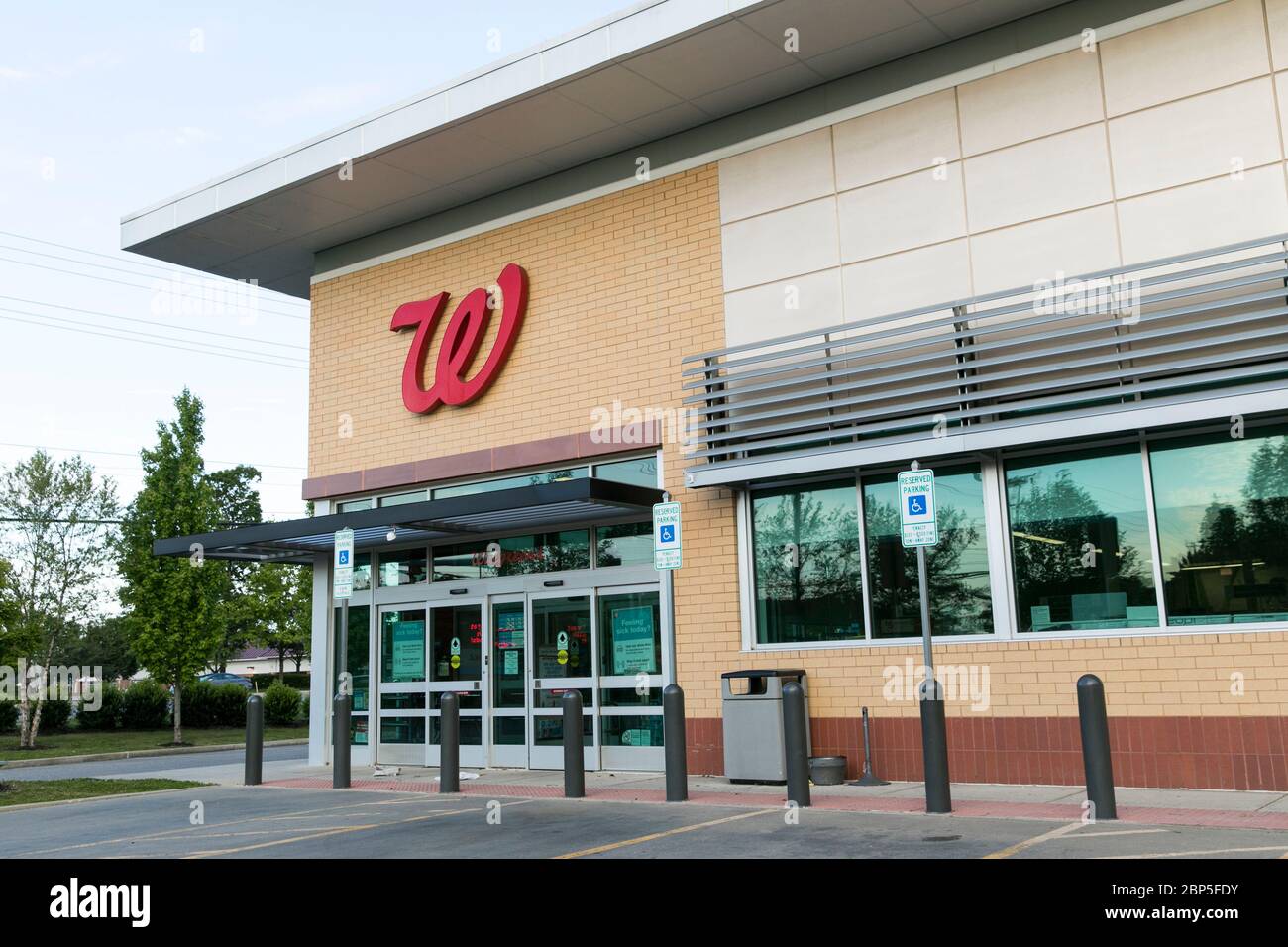 A logo sign outside of a Walgreens Pharmacy store location in Richmond ...
