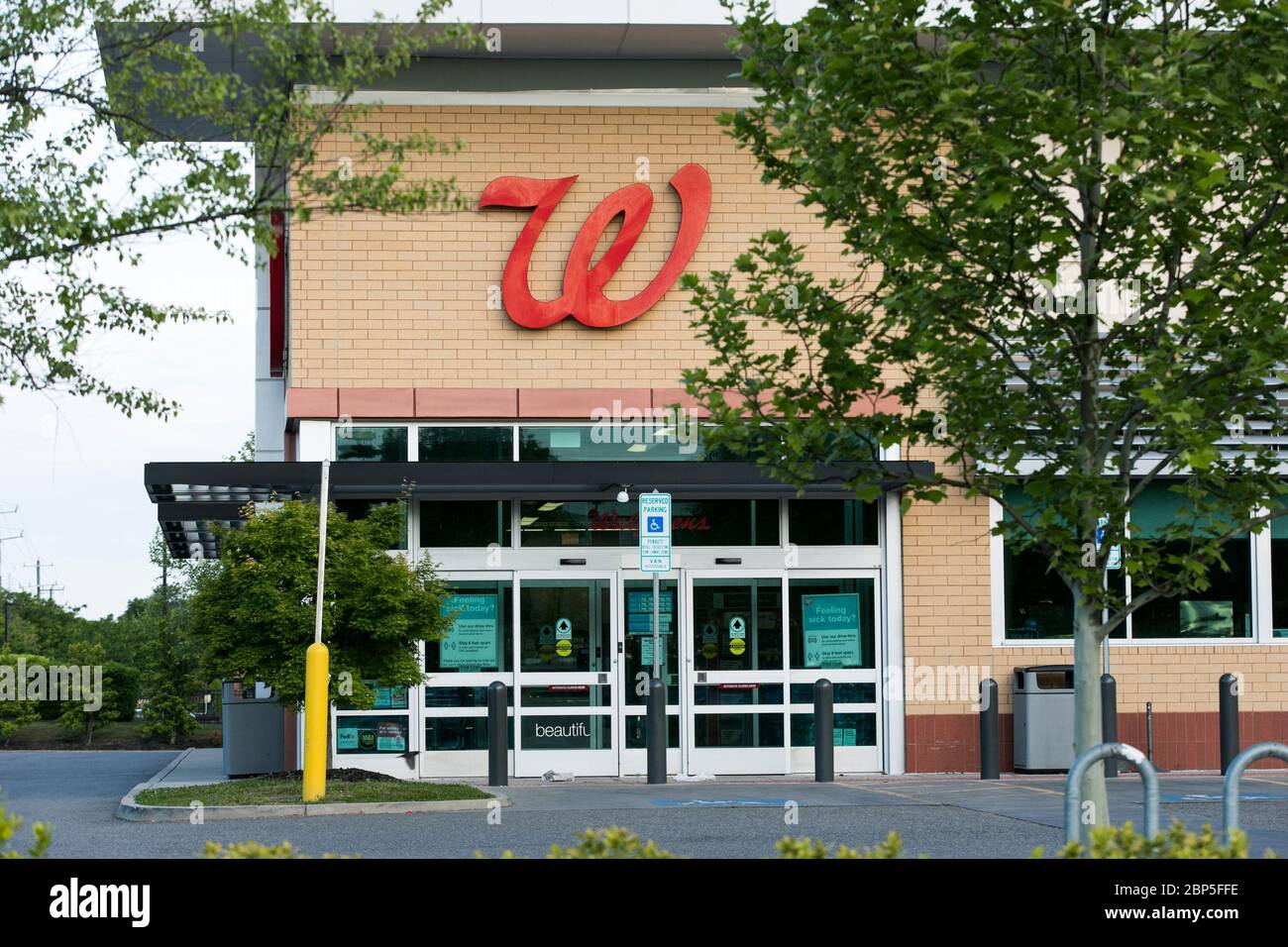 A logo sign outside of a Walgreens Pharmacy store location in Richmond ...