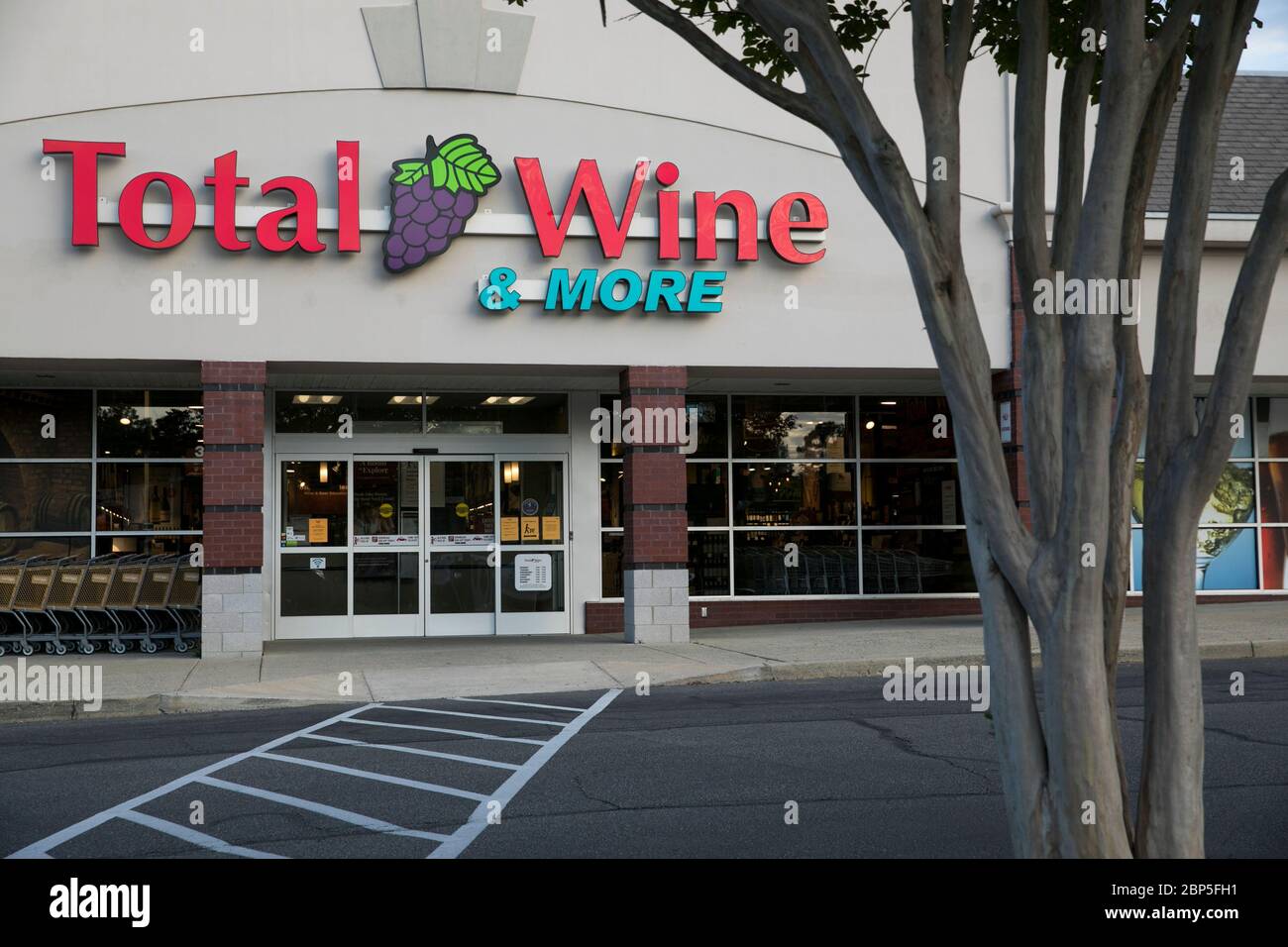 A logo sign outside of a Total Wine & More retail store location in ...