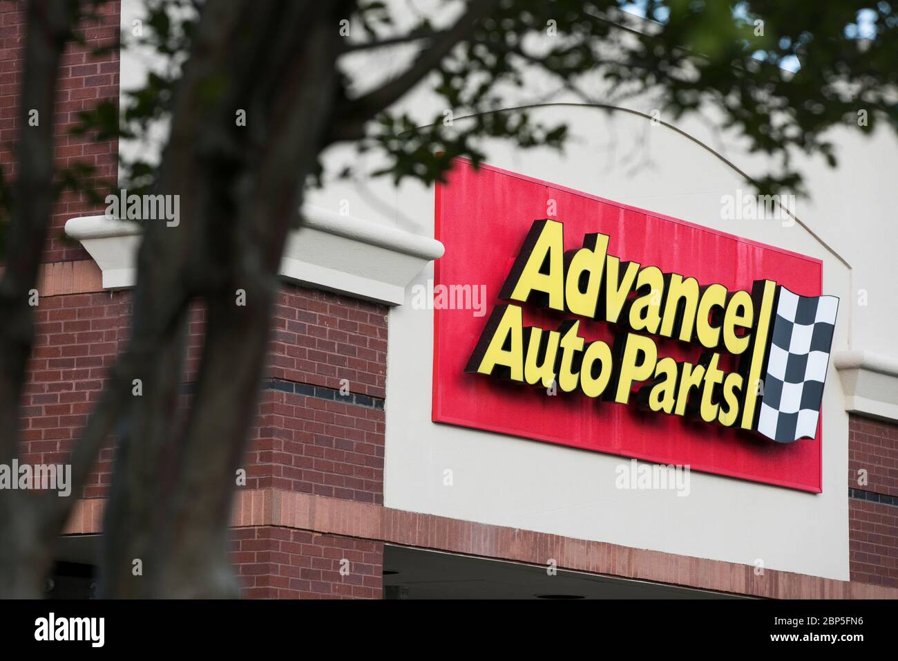A logo sign outside of a Advance Auto Parts retail store location in ...