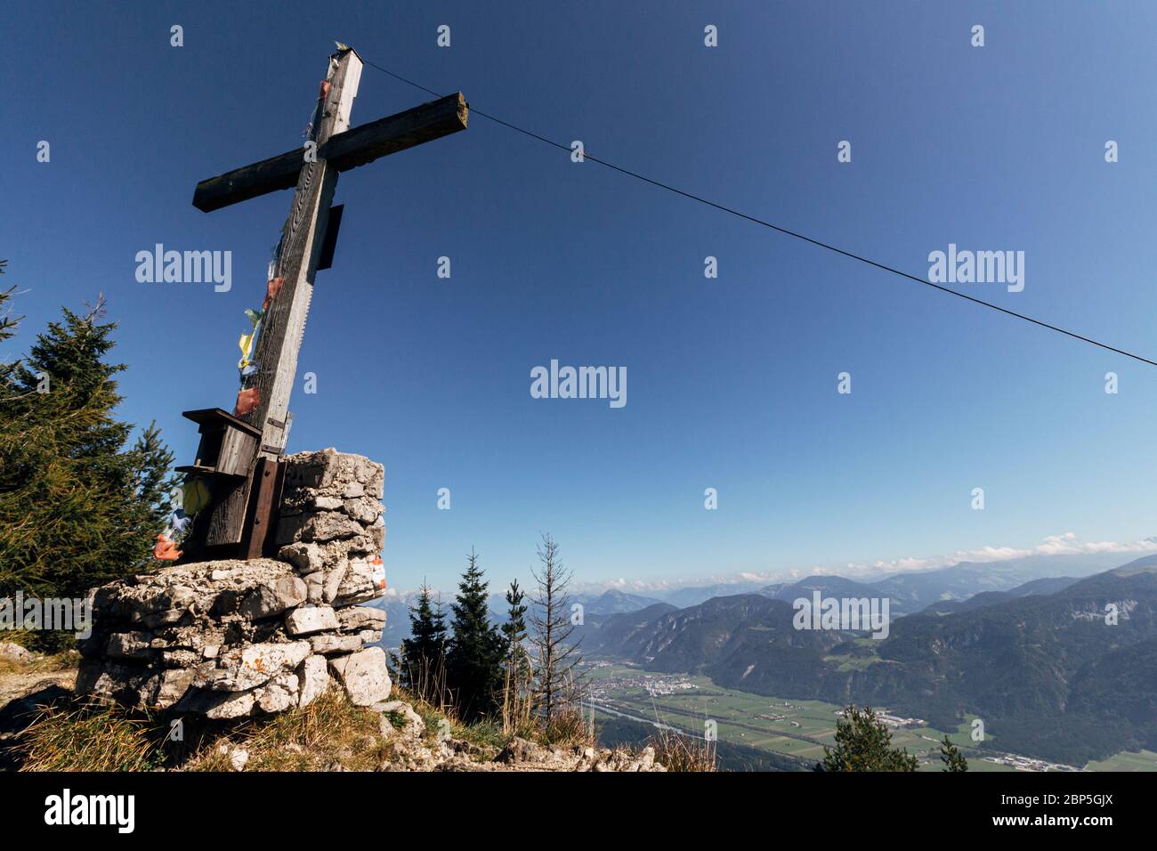 Cross at the top of a hiking trail on the outskirts of Brandenberg with ...