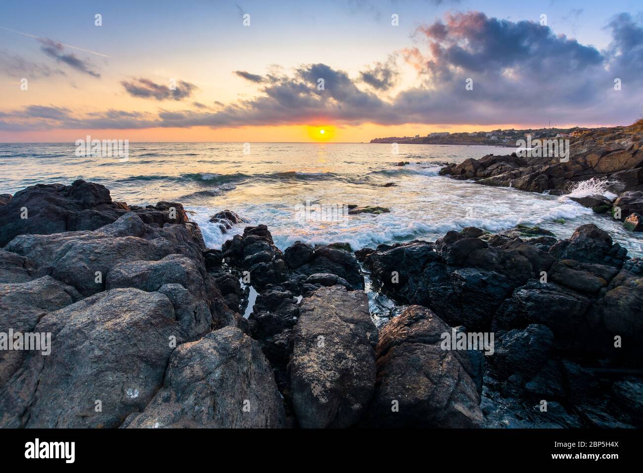 coast of the ocean at sunset. beautiful landscape with rocks in the ...