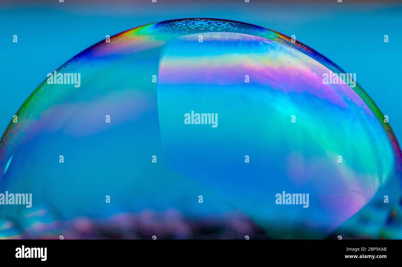Beautiful translucent soap bubble on dark background Stock Photo - Alamy