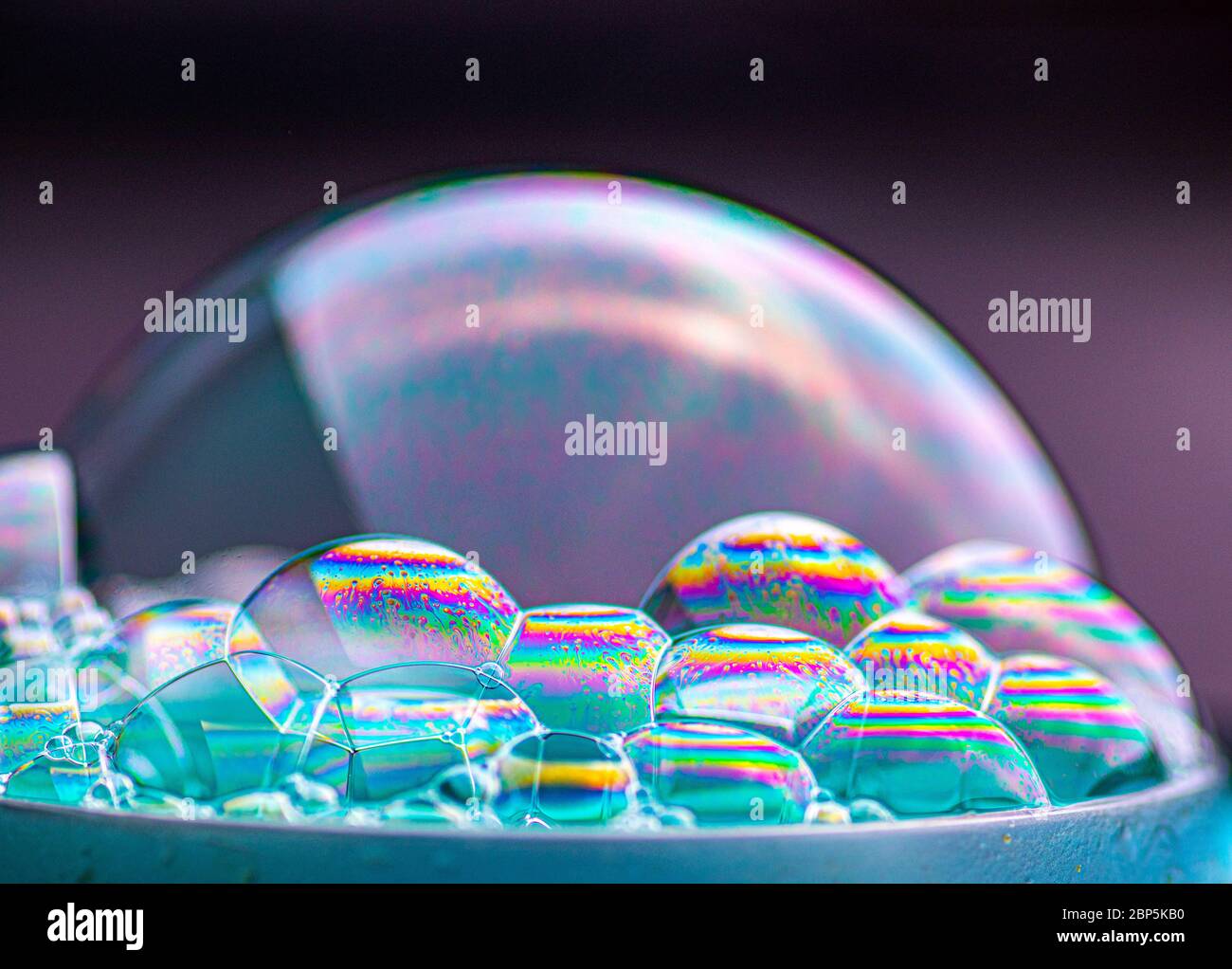 Beautiful translucent soap bubble on dark background Stock Photo - Alamy