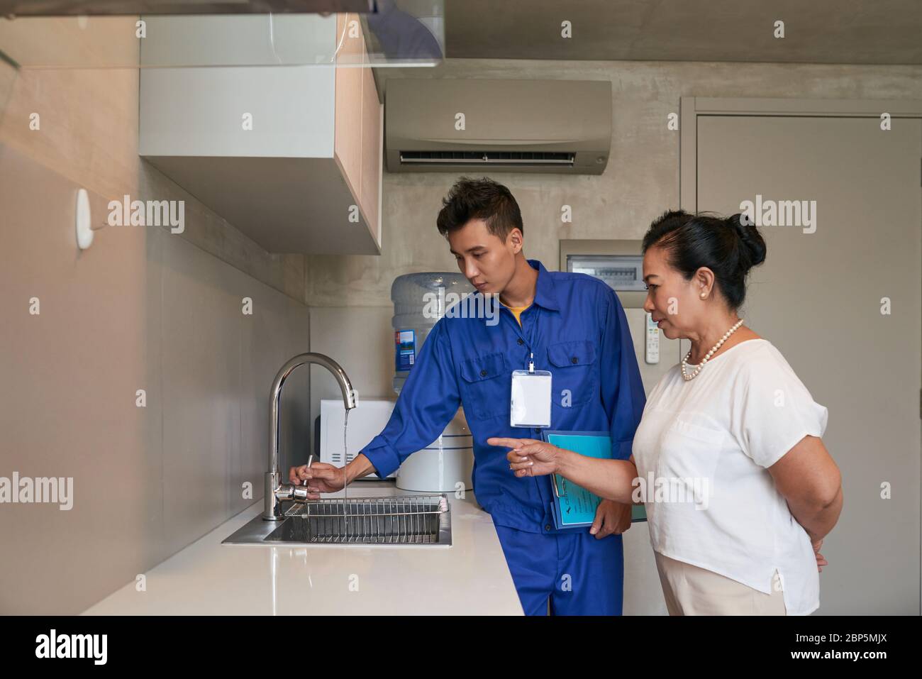 Leaking tap people hi-res stock photography and images - Alamy