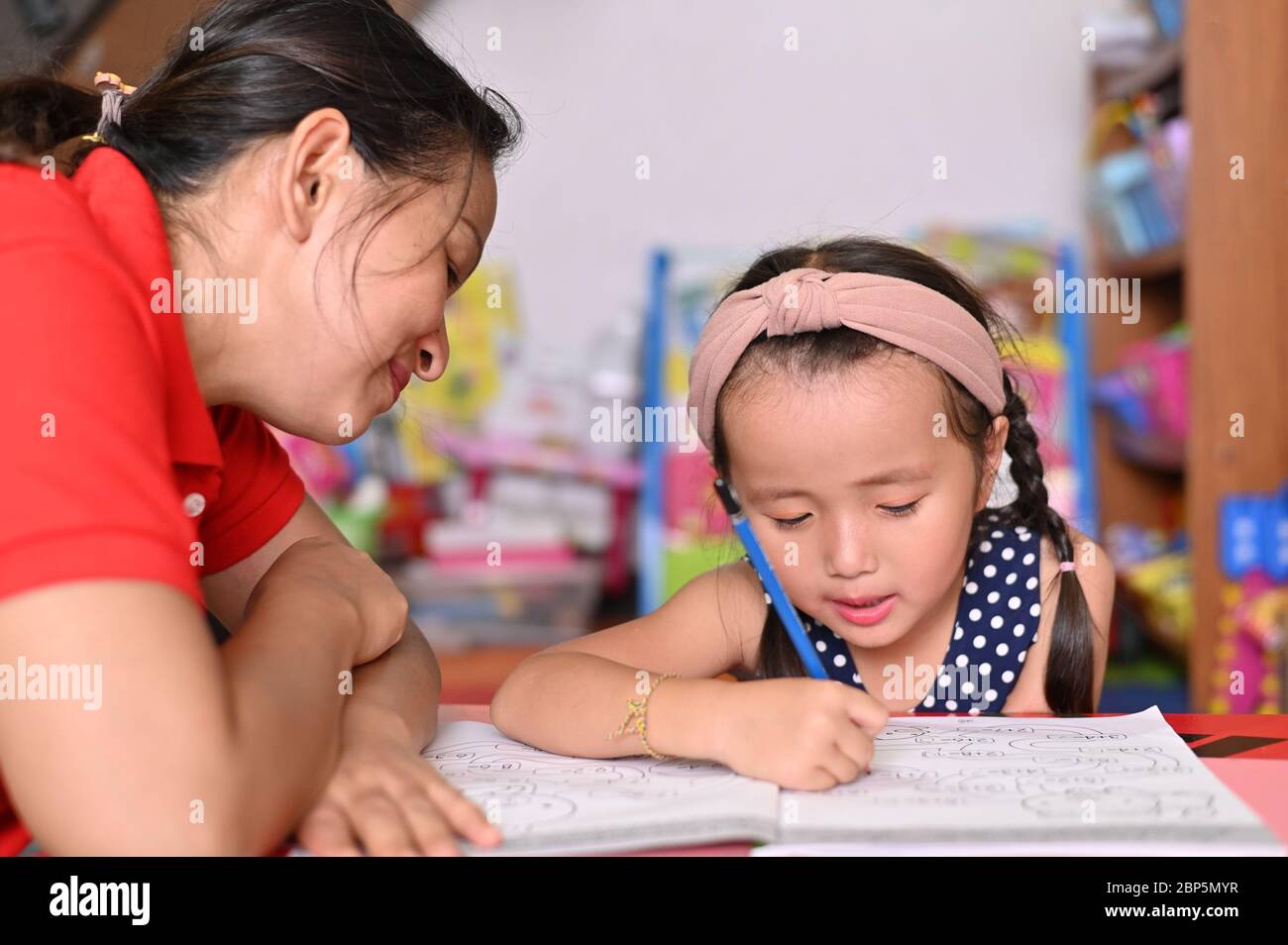 At home teacher hi-res stock photography and images - Alamy