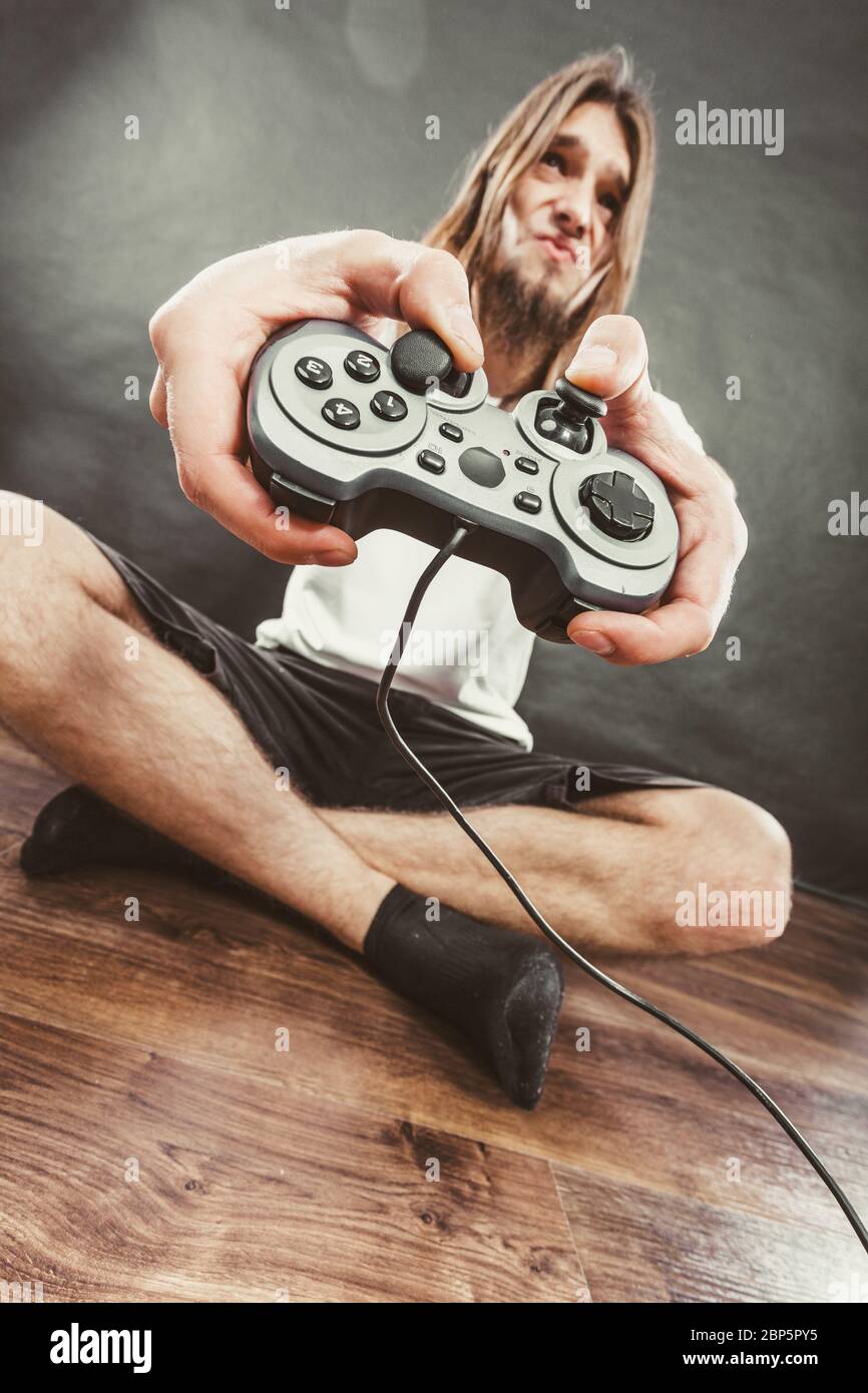 Addiction effects concept. Young unhappy depressed man with pad ...