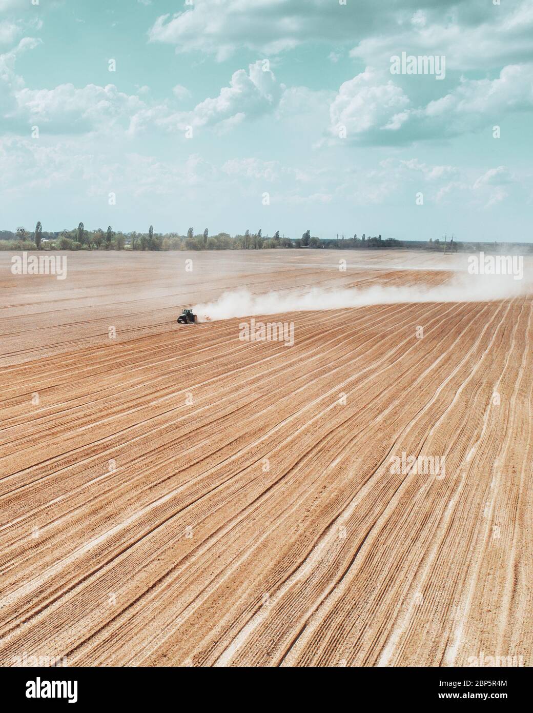 Aerial view of a tractor working in a field Stock Photo - Alamy