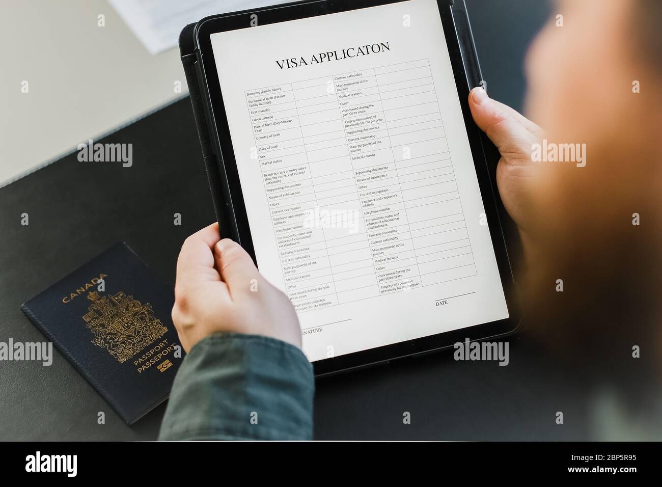 Close up businessman getting visa and reading application on tablet ...