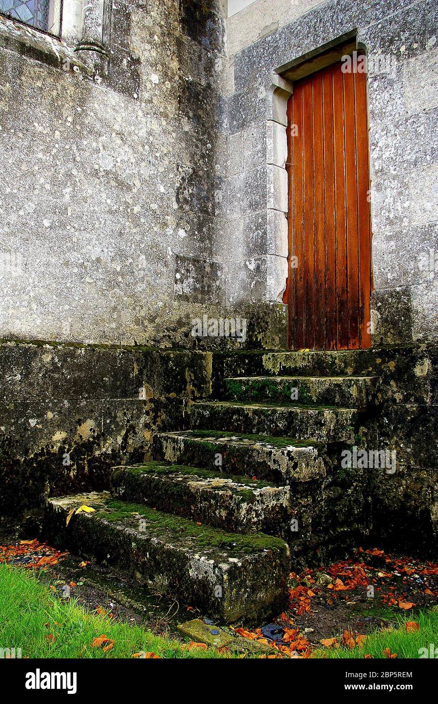 Mossy steps at the church in St. Cyran du Jambot Stock Photo - Alamy