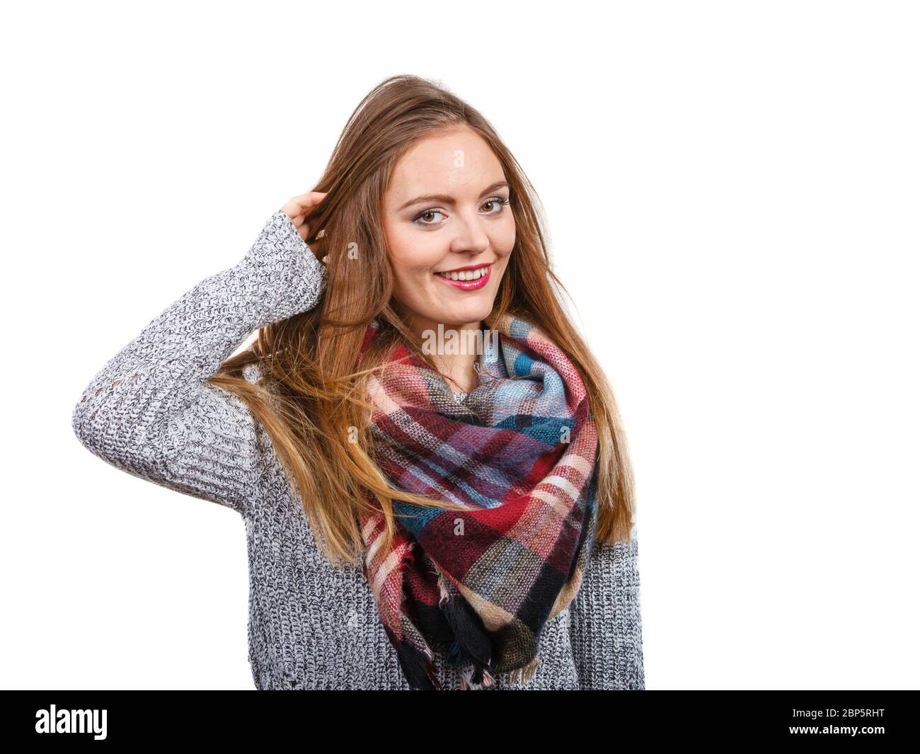 Portrait of long hair girl in gray sweater and warm woolen big scarf ...