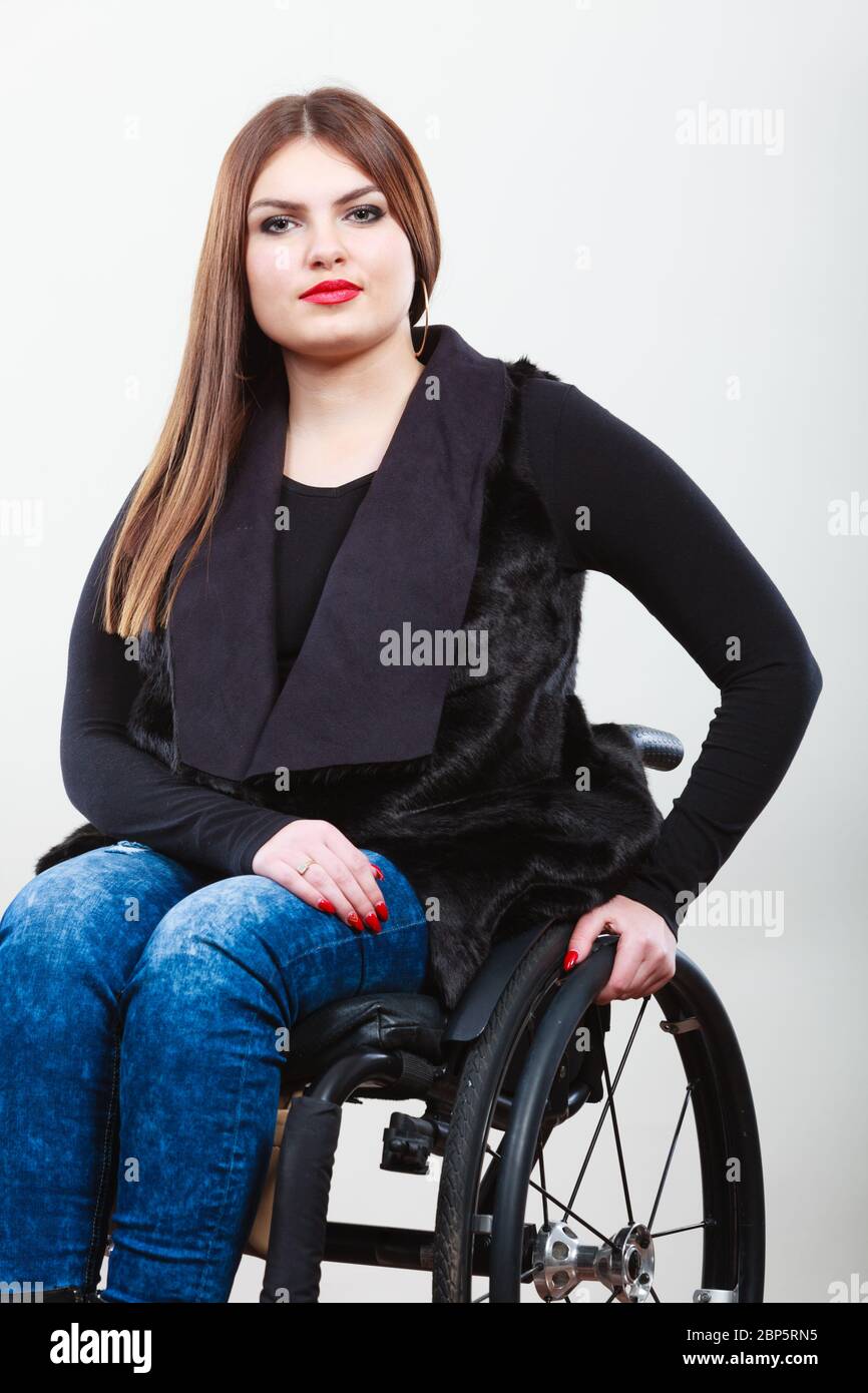 Disability and handicap concept. Young teen handicapped girl sitting on ...