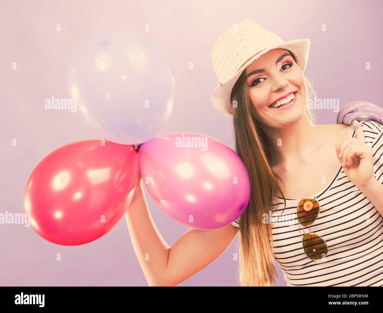 Girl dancing with balloons. Young female partying cheering. Celebration ...