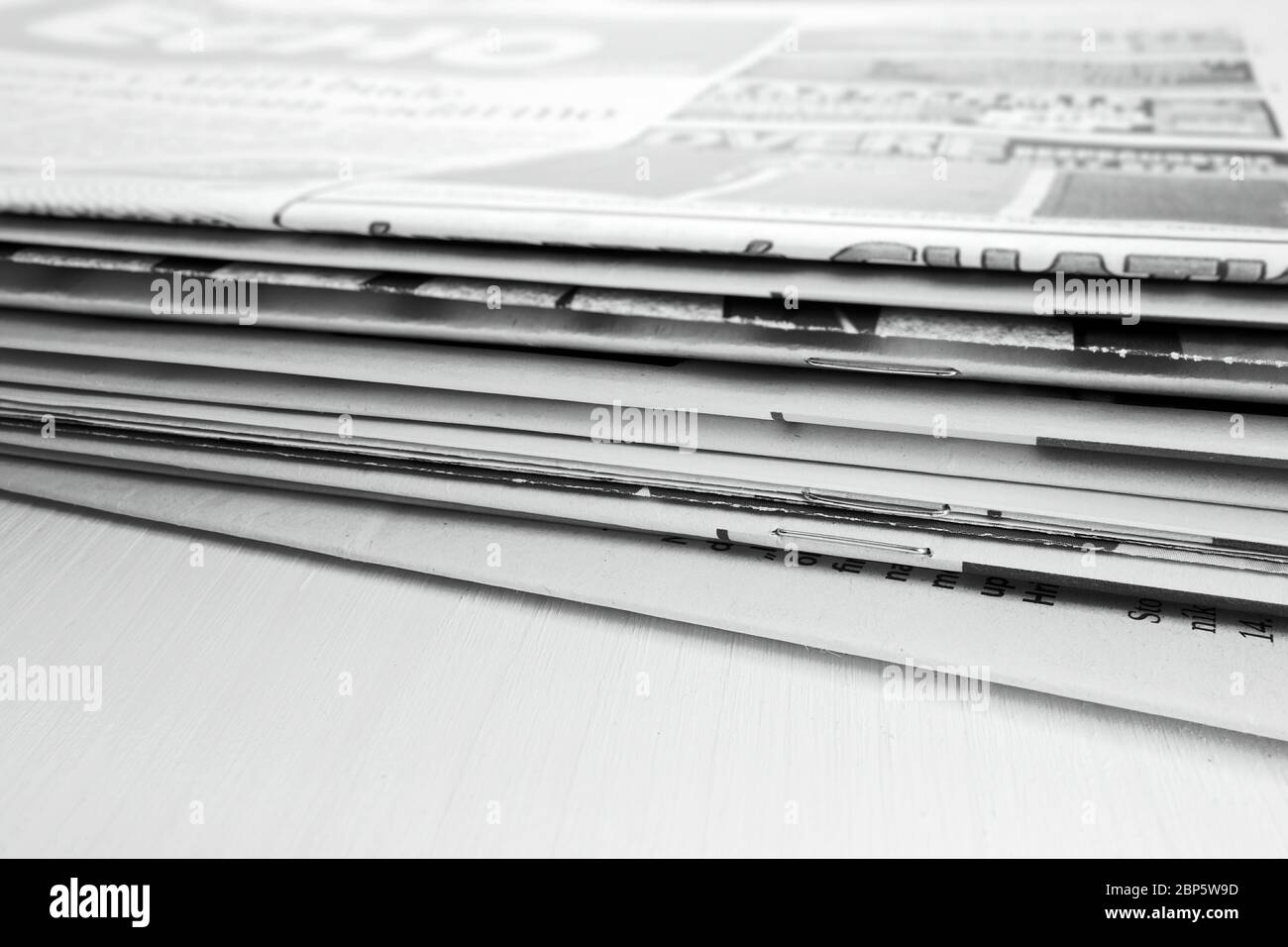 Stack of newspapers on table hi-res stock photography and images - Alamy