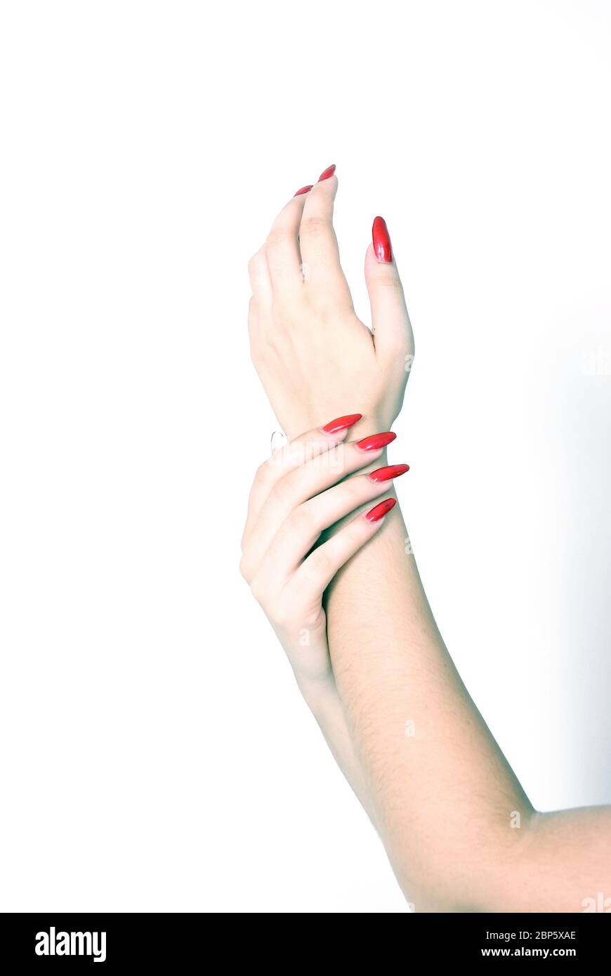 Female hand showing red nails hi-res stock photography and images - Alamy