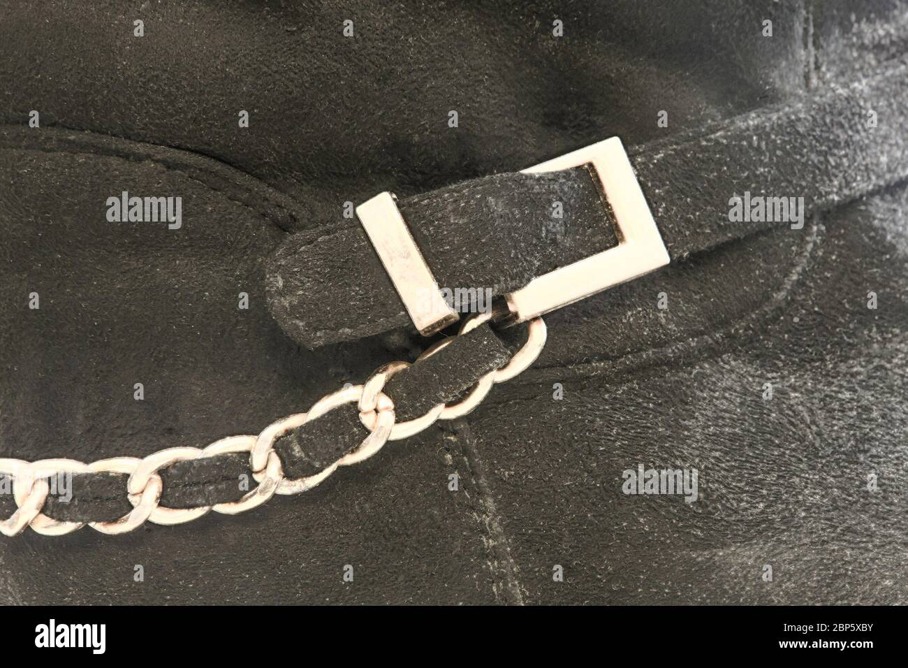 image background bootleg of a leather boot with a yellow buckle and ...