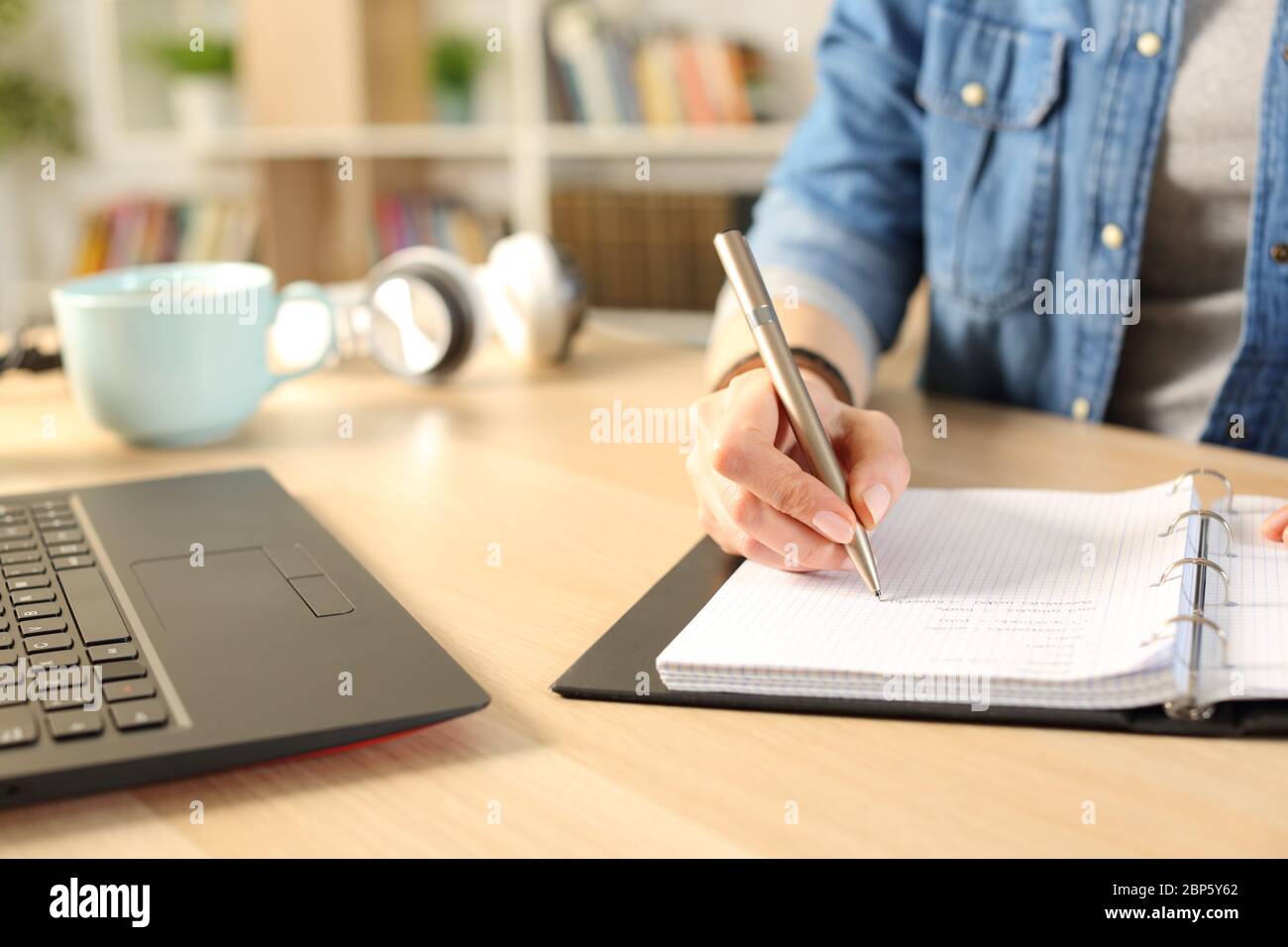 Student writing paper desk hi-res stock photography and images - Alamy