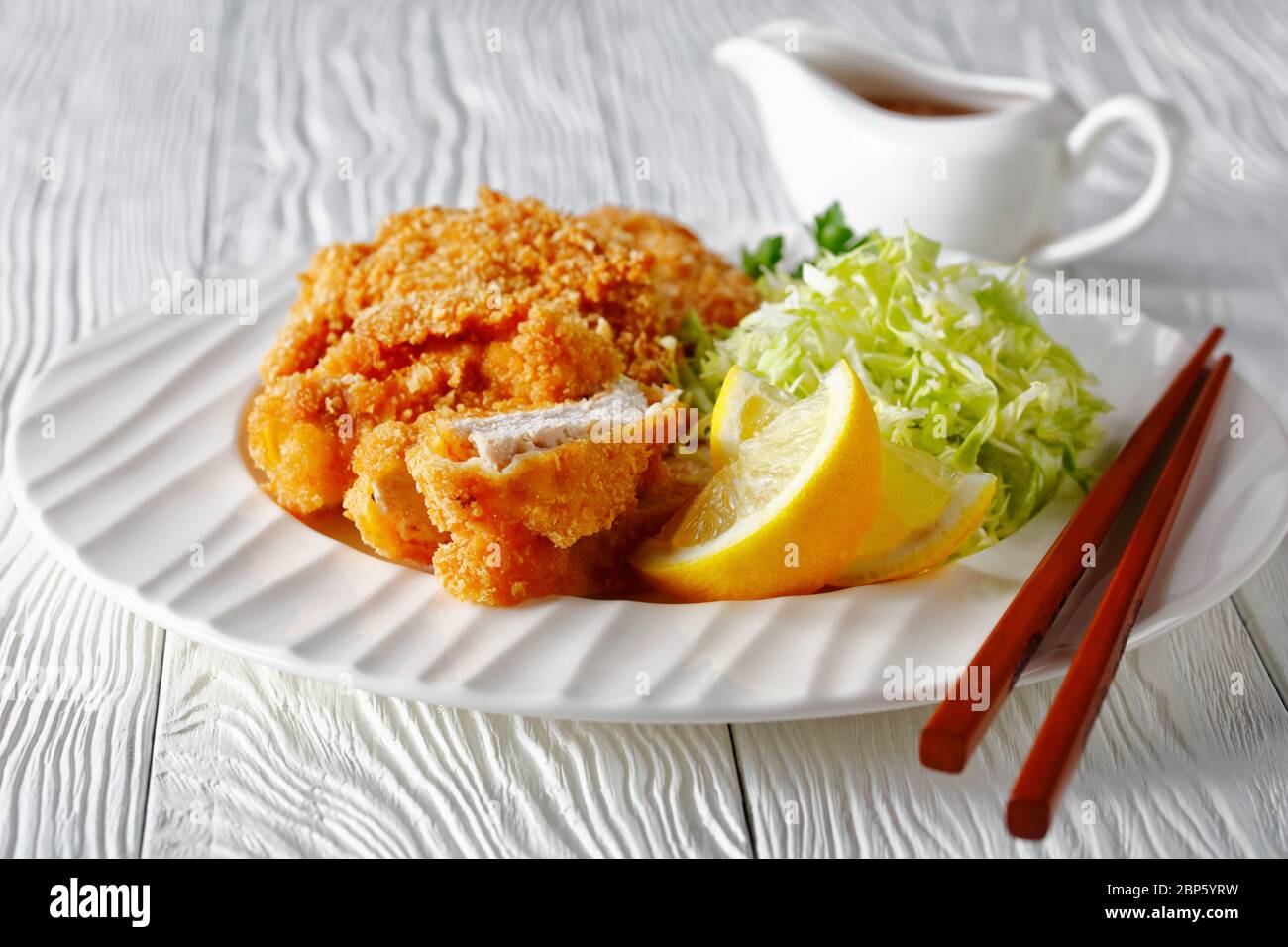 Japanese deep fried pork fillets, Hireatsu, served with finely shredded ...