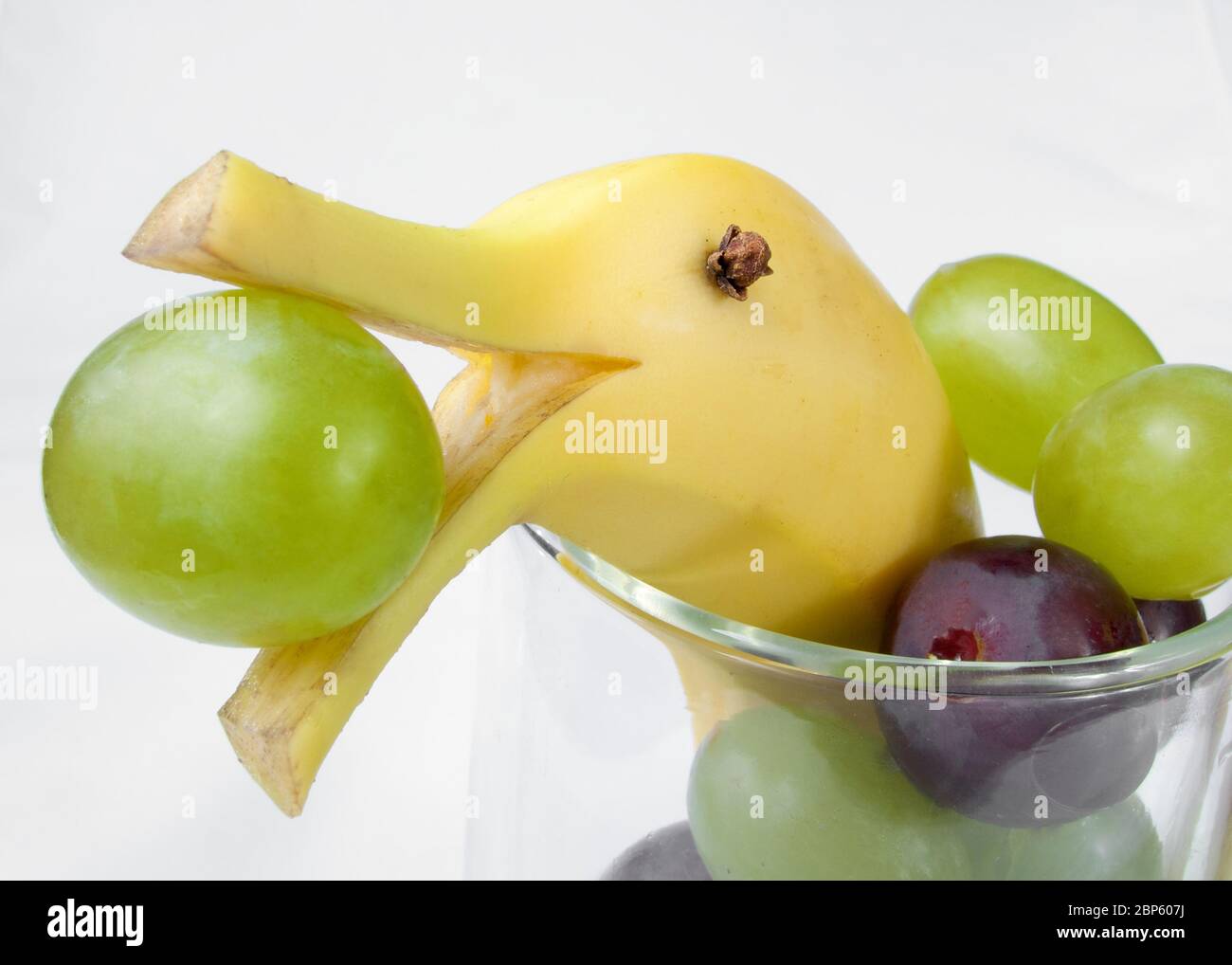 Banana dolphin with berries Stock Photo - Alamy