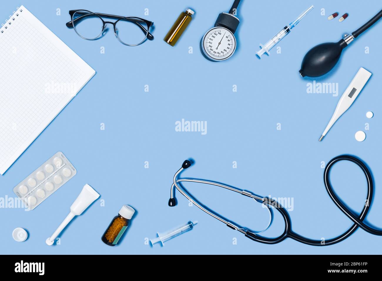 Medical blue background with different accessories: stethoscope ...