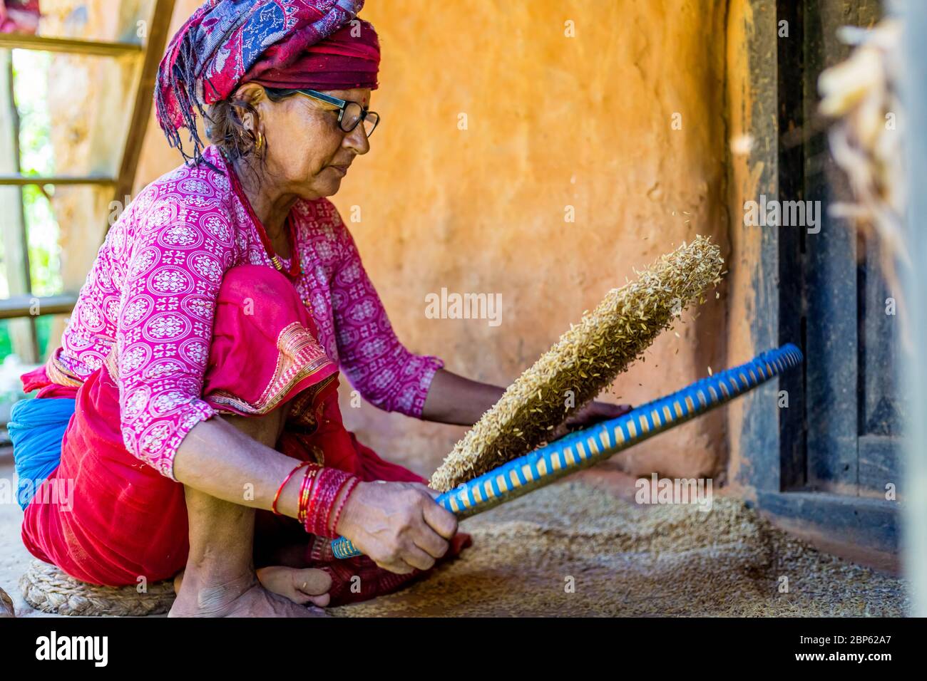 Gorkha, Nepal - July 13,2018 : Old Nepali Woman Sifting Rice ...