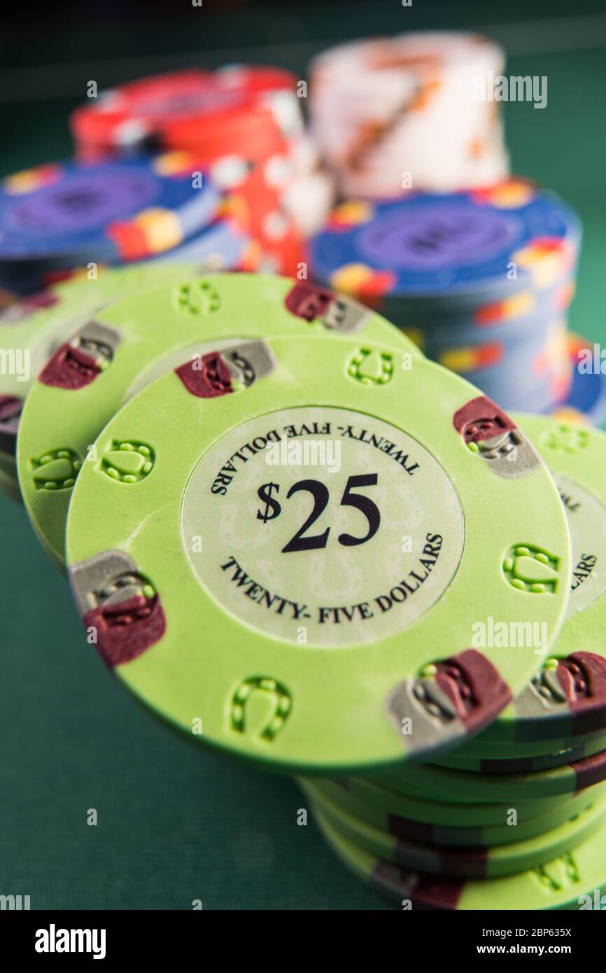 Casino chips on a gaming table Stock Photo - Alamy