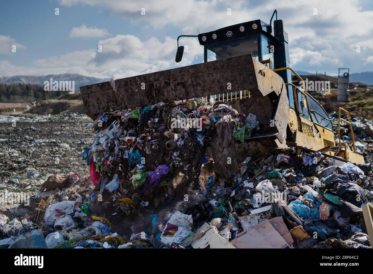 Garbage truck unloading waste on landfill, environmental concept Stock ...