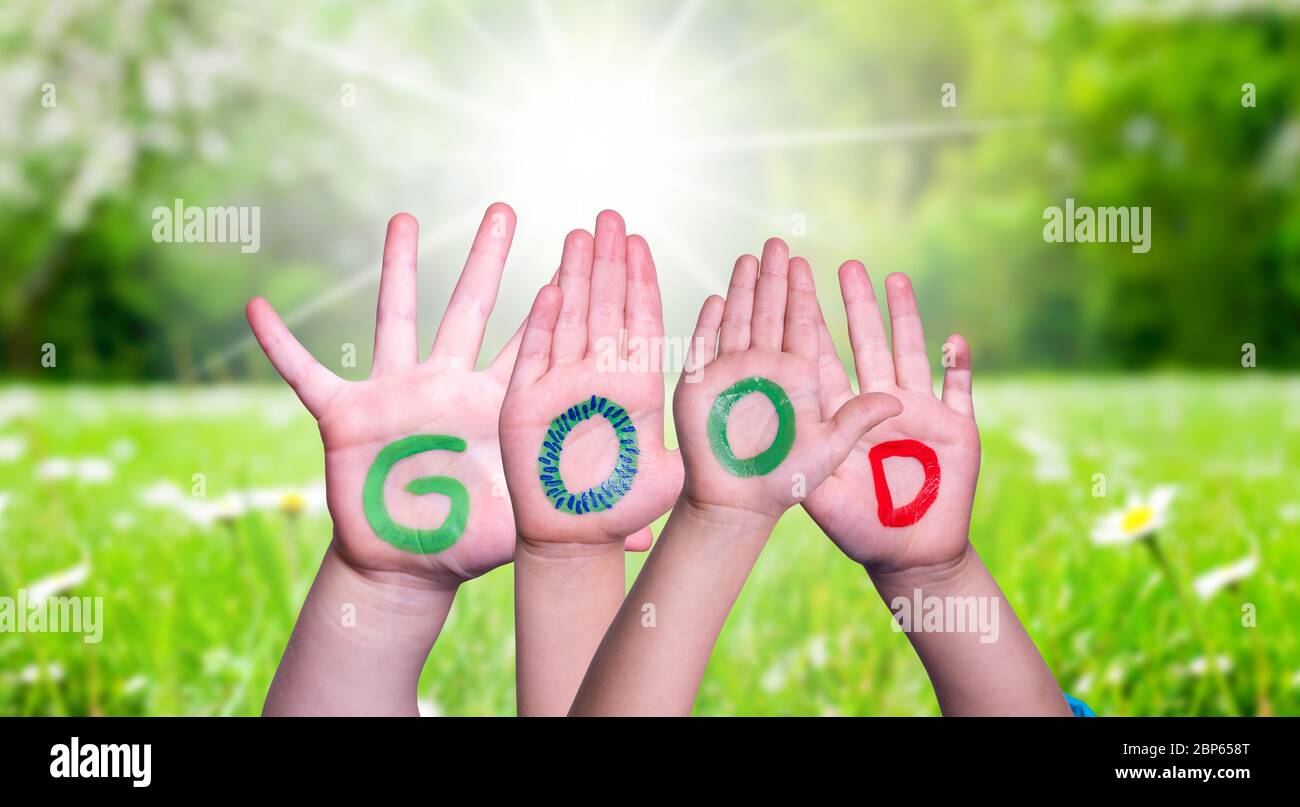 Children Hands Building Word Good, Grass Meadow Stock Photo - Alamy