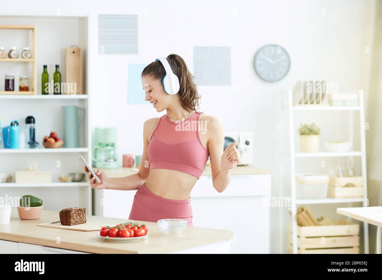 Woman dancing in kitchen hi-res stock photography and images - Alamy