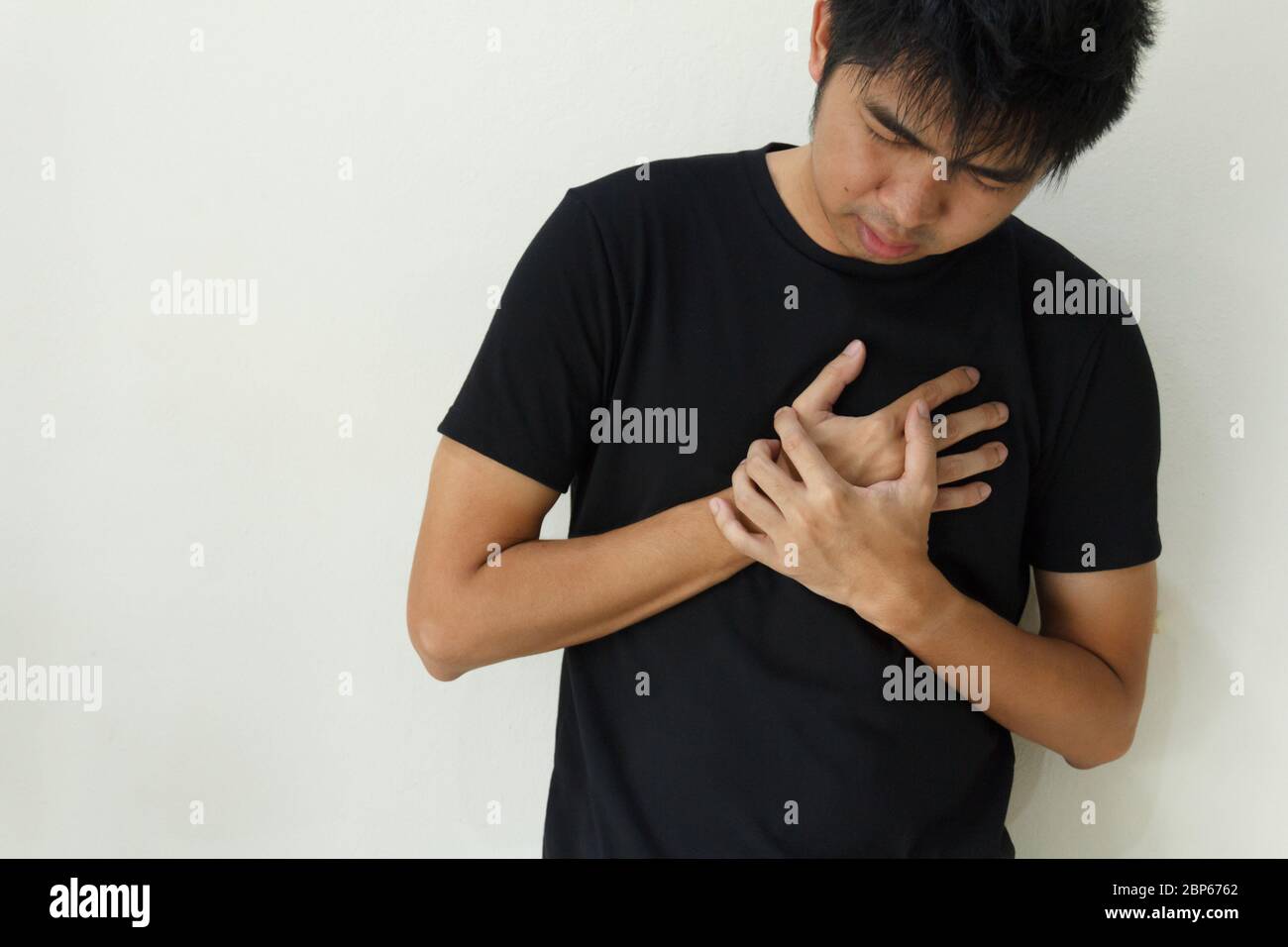 The man suffering from chest pain heart attack Stock Photo - Alamy