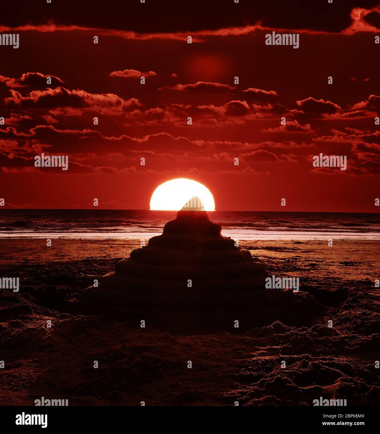 Sand pyramid at sunset on beach. Beauty and mystery of tourist travel ...